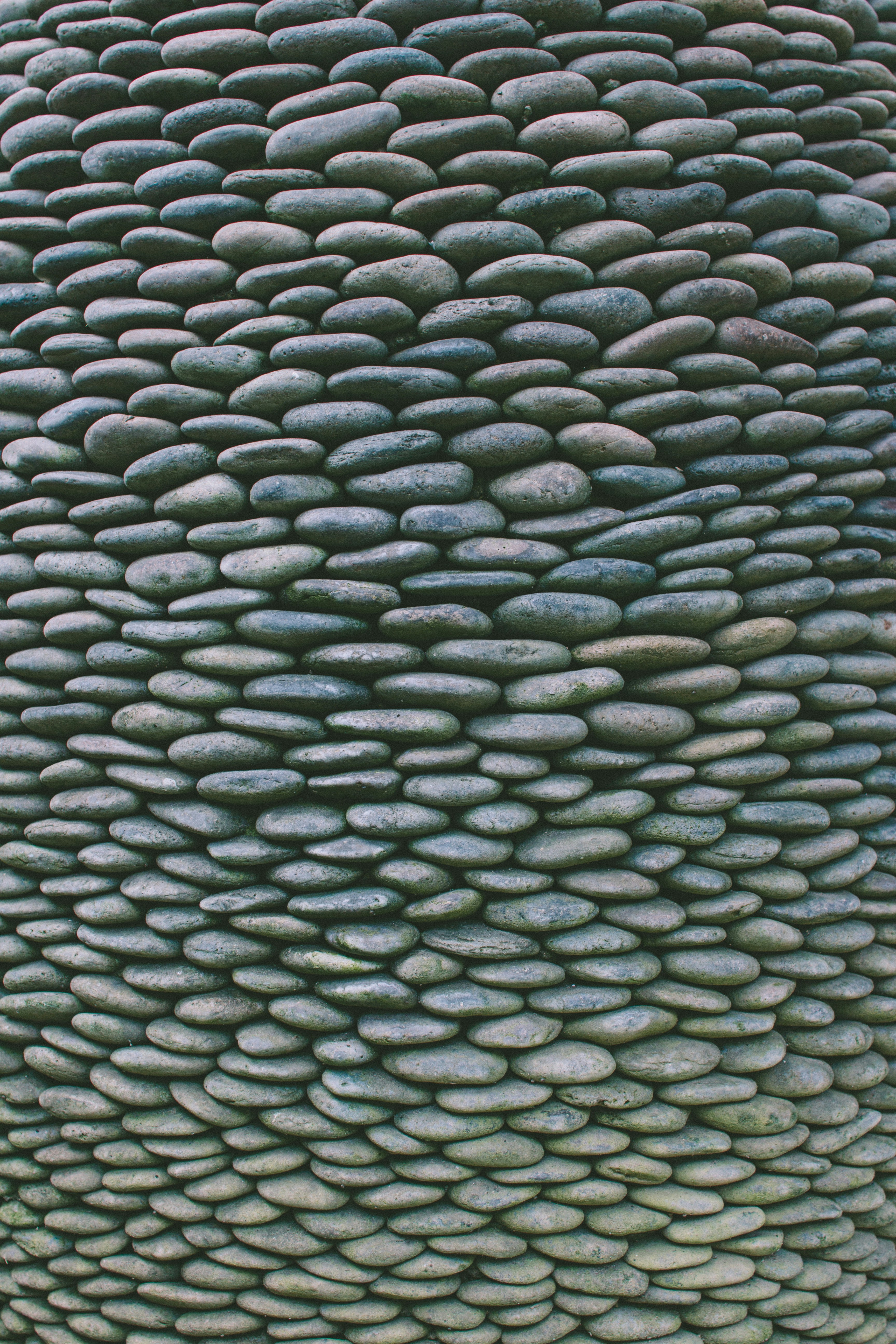 Pebble Quilt: a sea of smooth river stones laid in a rippling, tactile mosaic