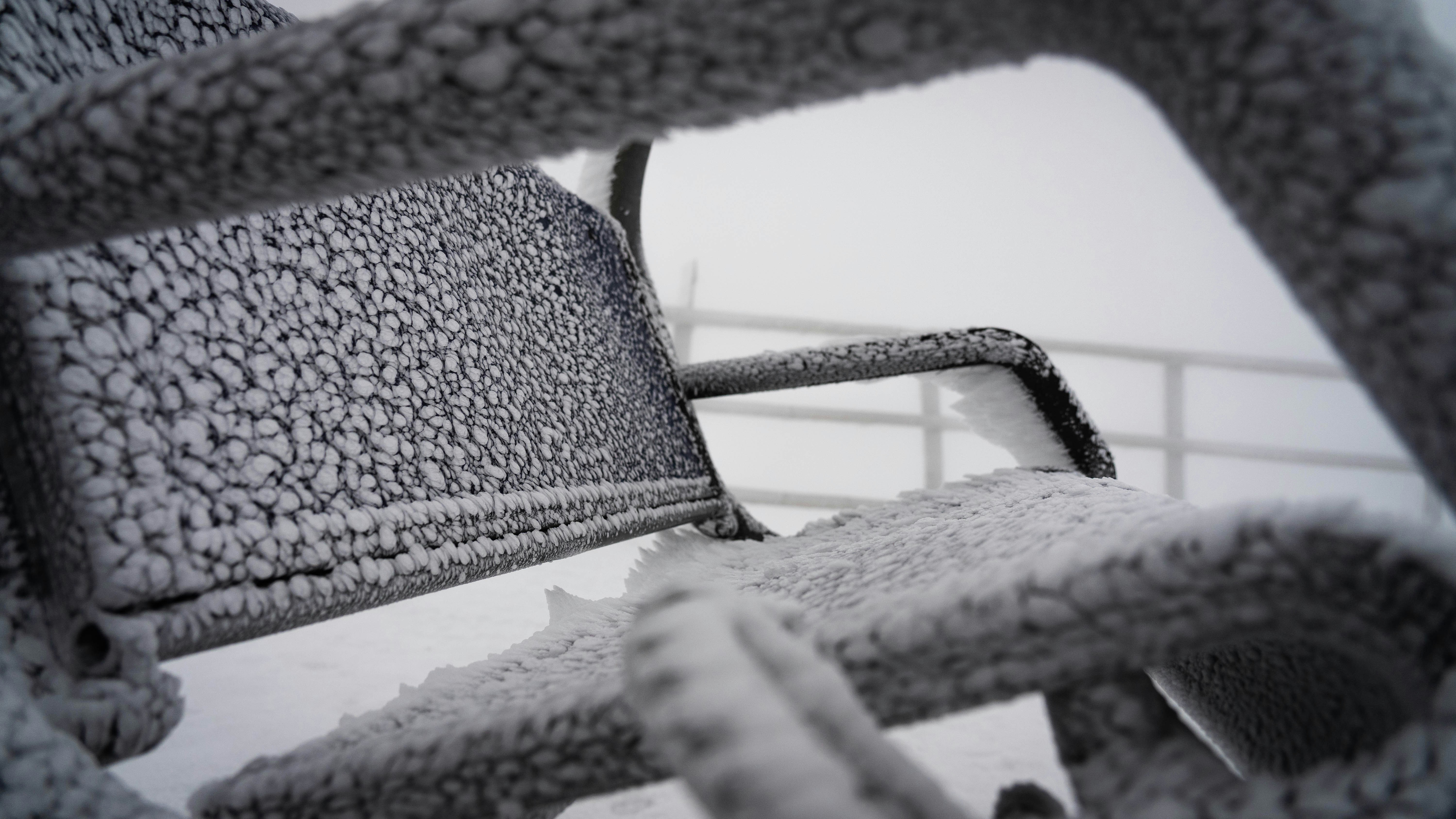 Frosted Rails: A Close-Up of Industrial Texture in Cold Light