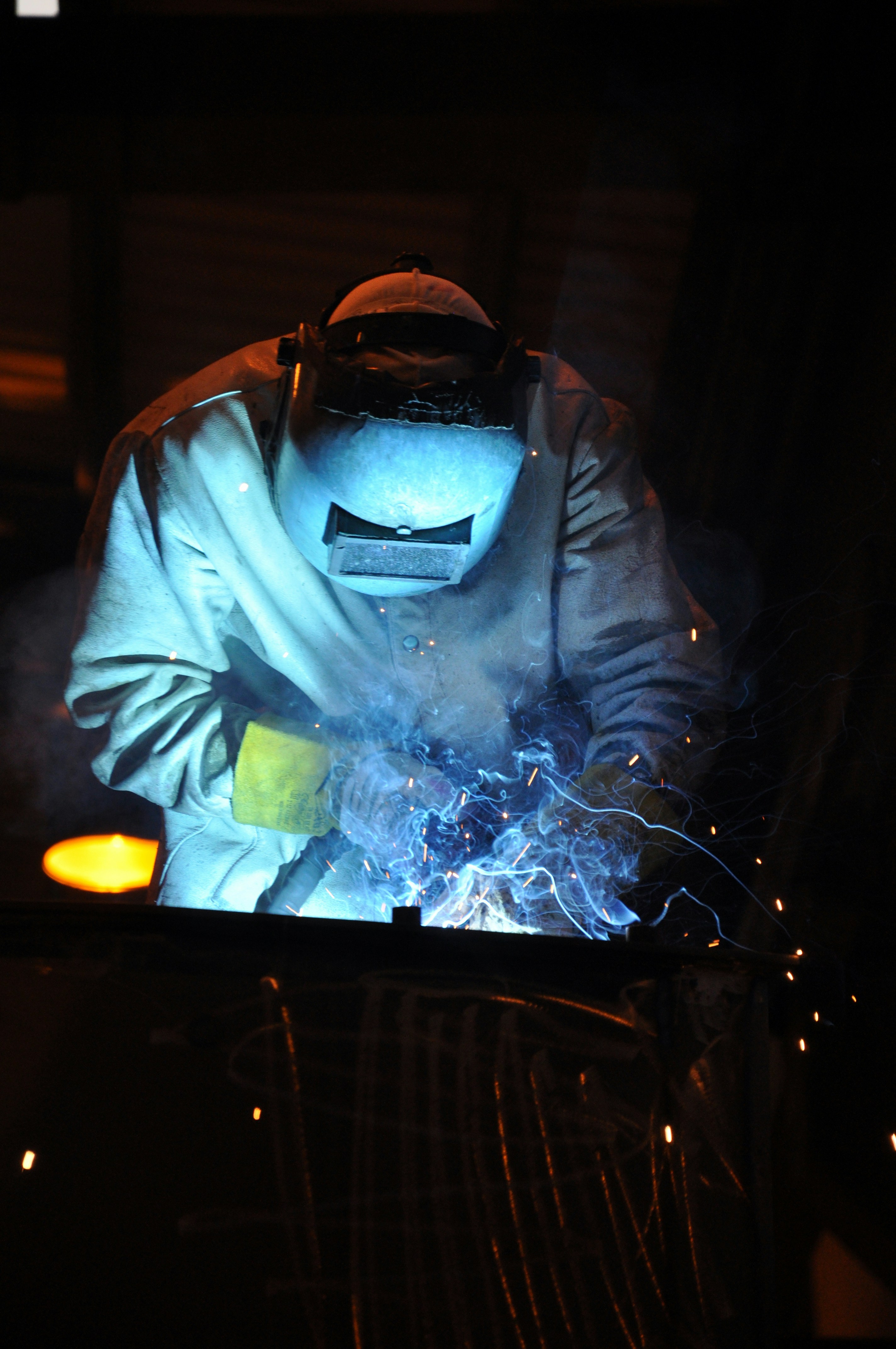 Neon Arc in the Dark: A Welder's Quiet Forge