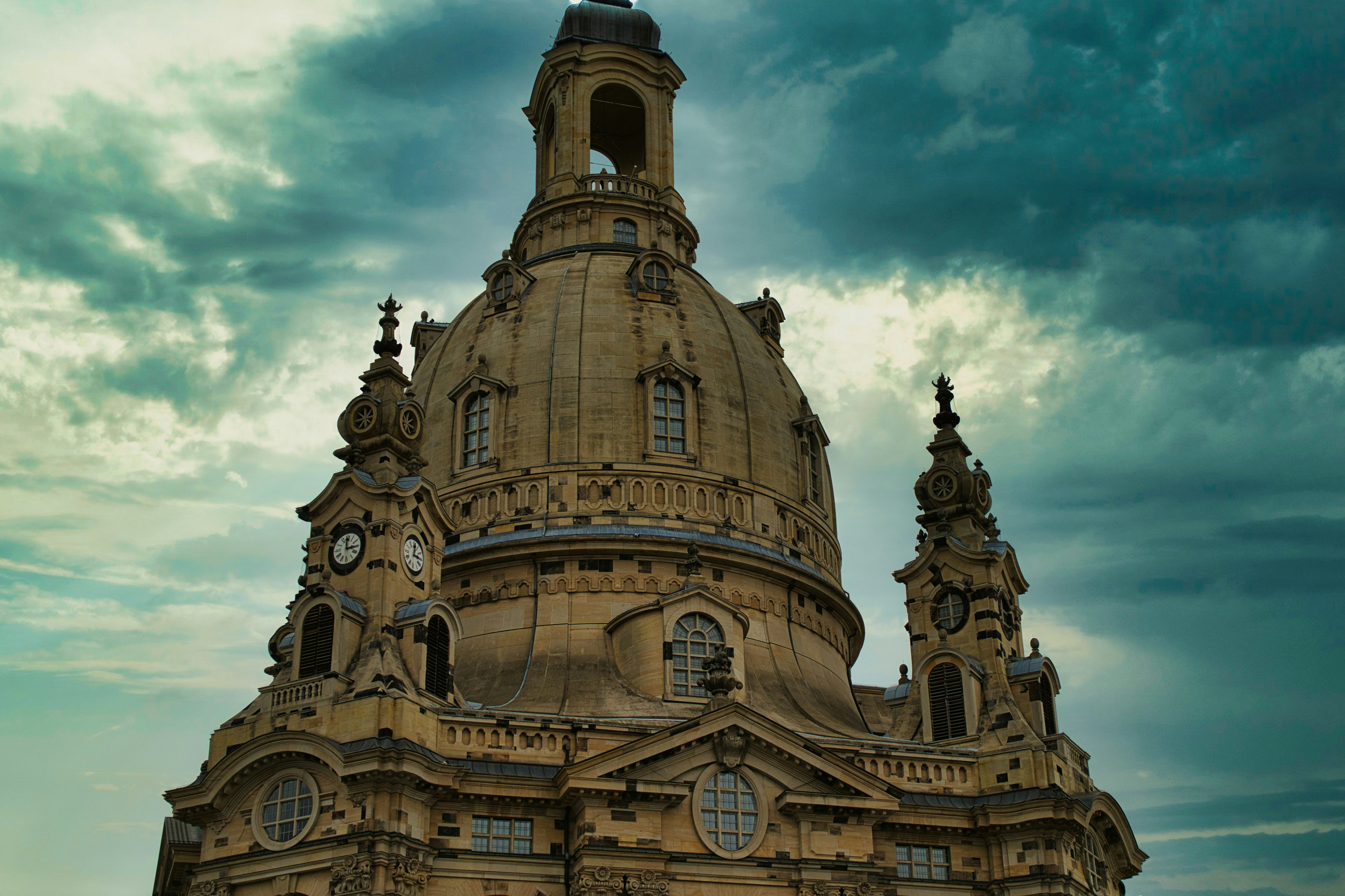 brown concrete building under cloudy sky during daytime