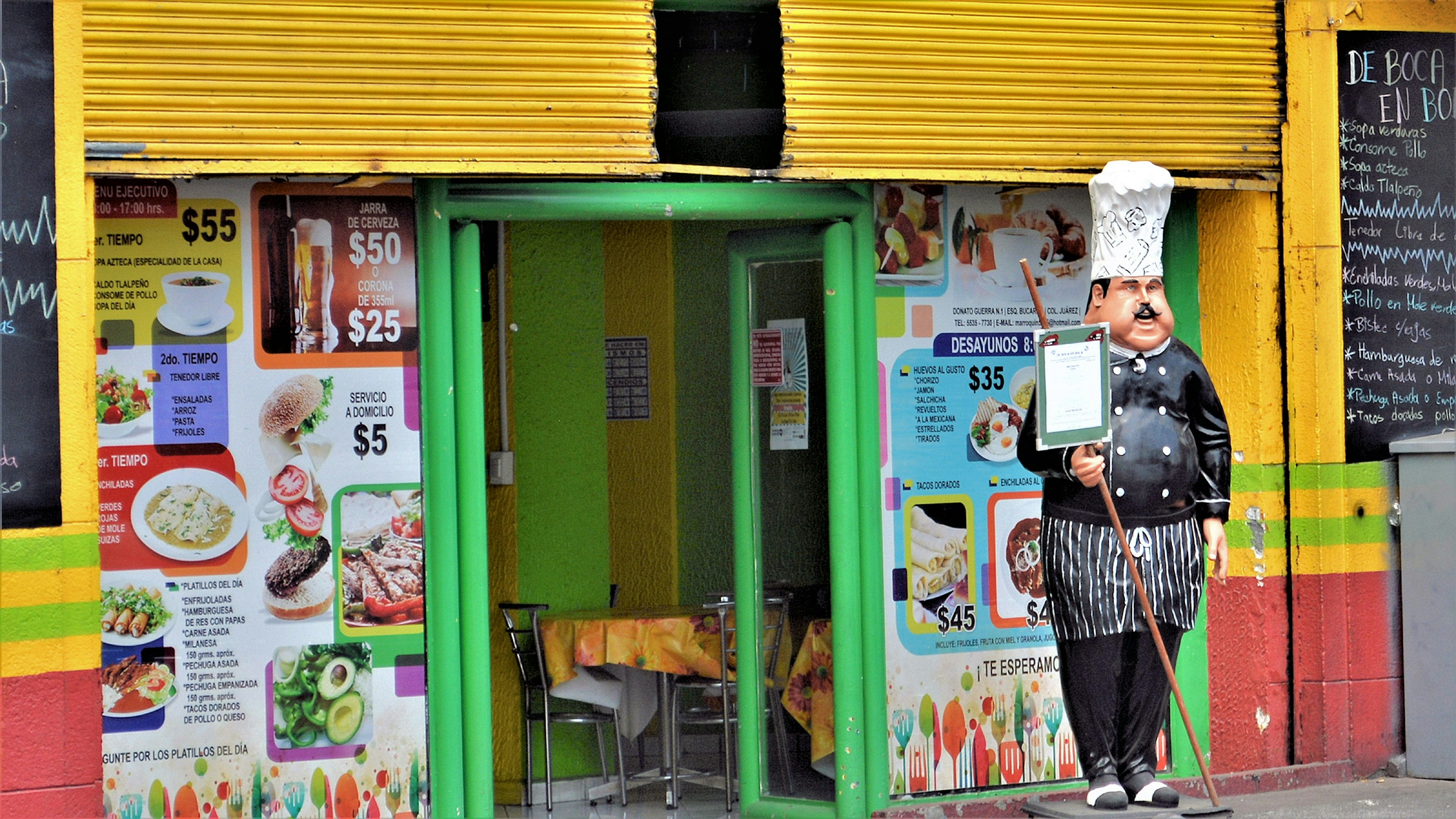 Color-Splashed Entrance: A Street Bistro Framed by a Costumed Chef