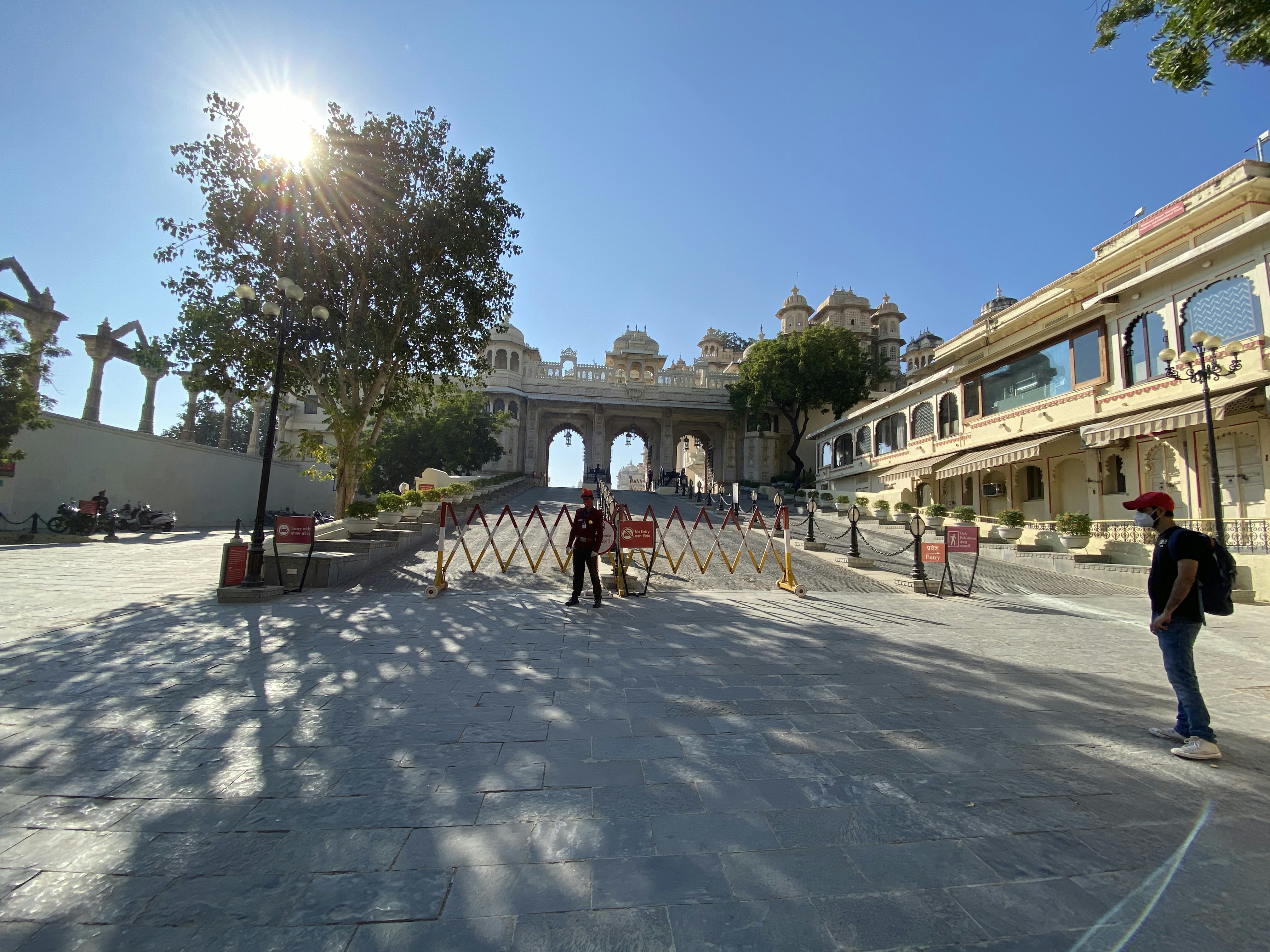 Sunlit Archway Over an Ordered Piazza