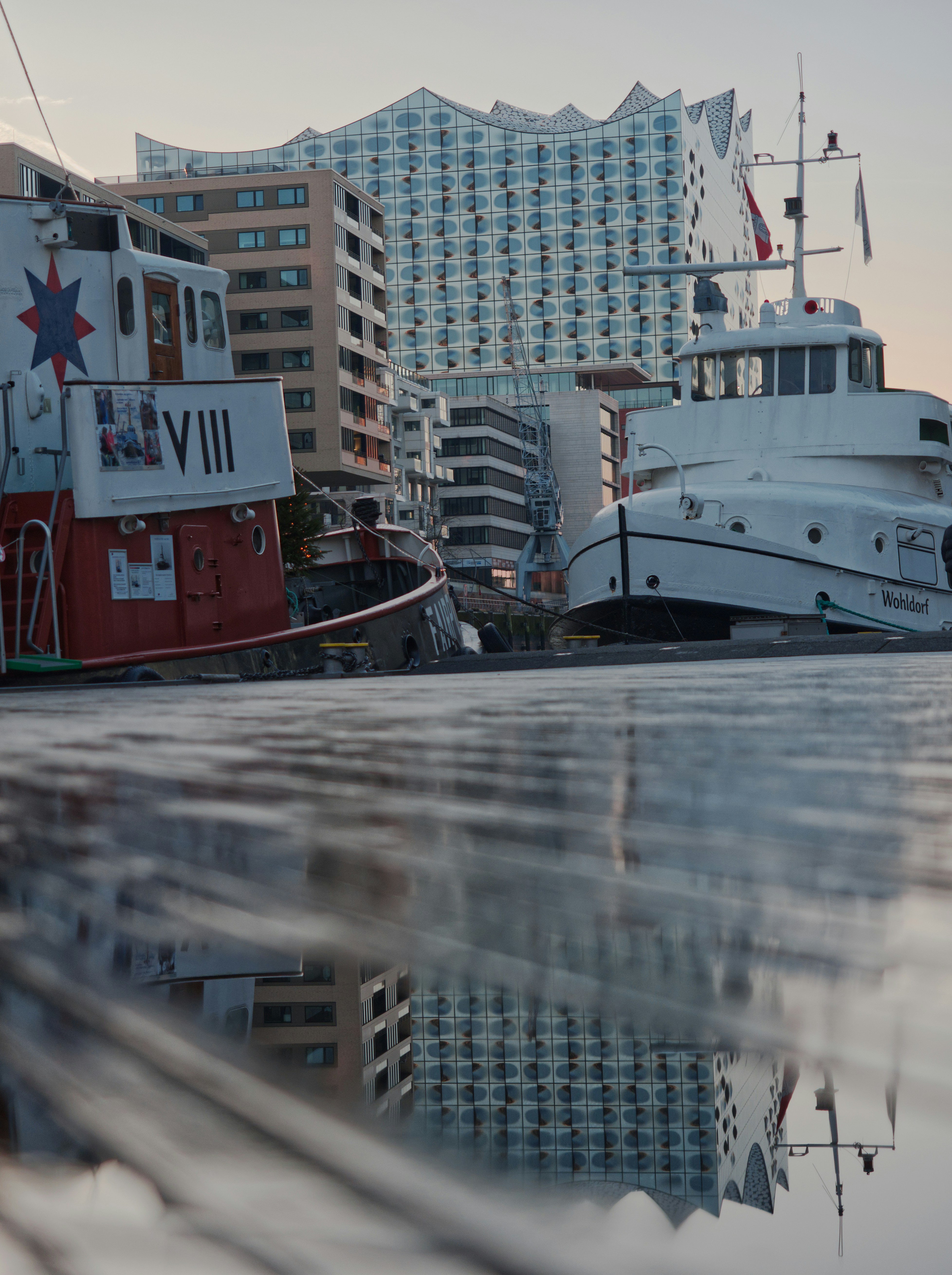 Glasswave Harbor: Moored Vessels Framed by a Modern Skyline