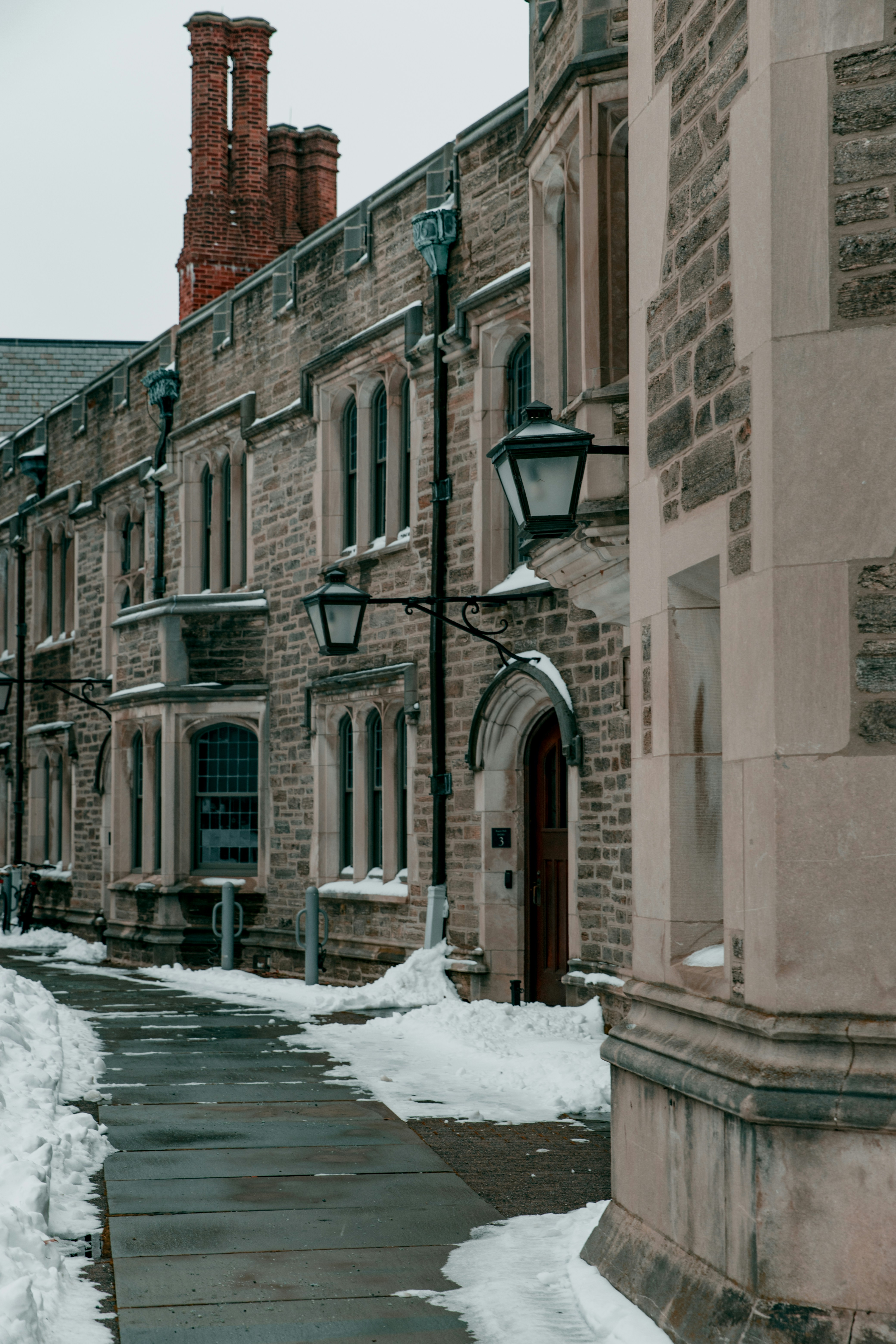 Brown concrete building covered with snow during daytime photo – Free ...