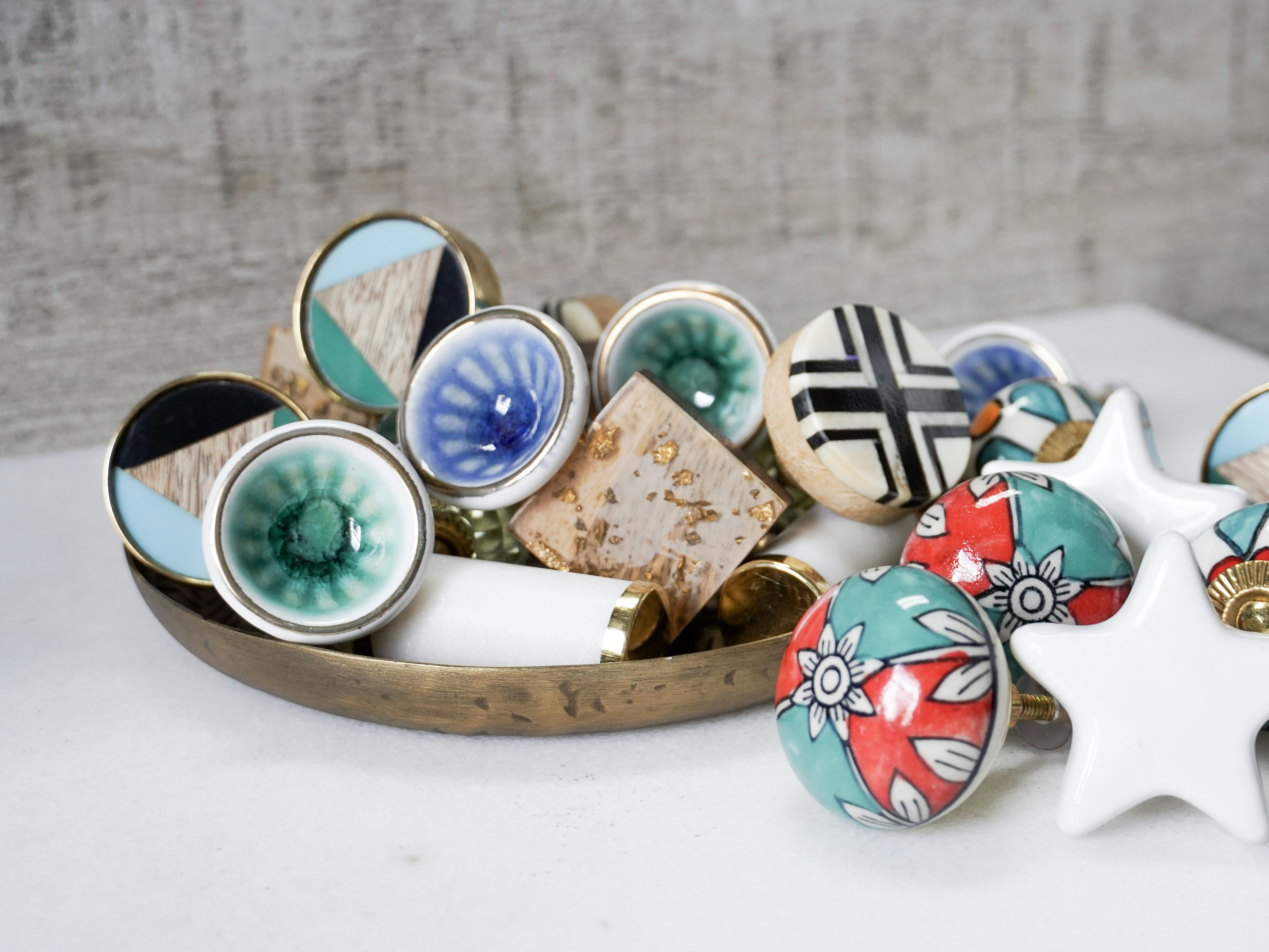 Brass Bowl of Orbs: A Colorful Still-Life of Patterned Circles and Star Accents