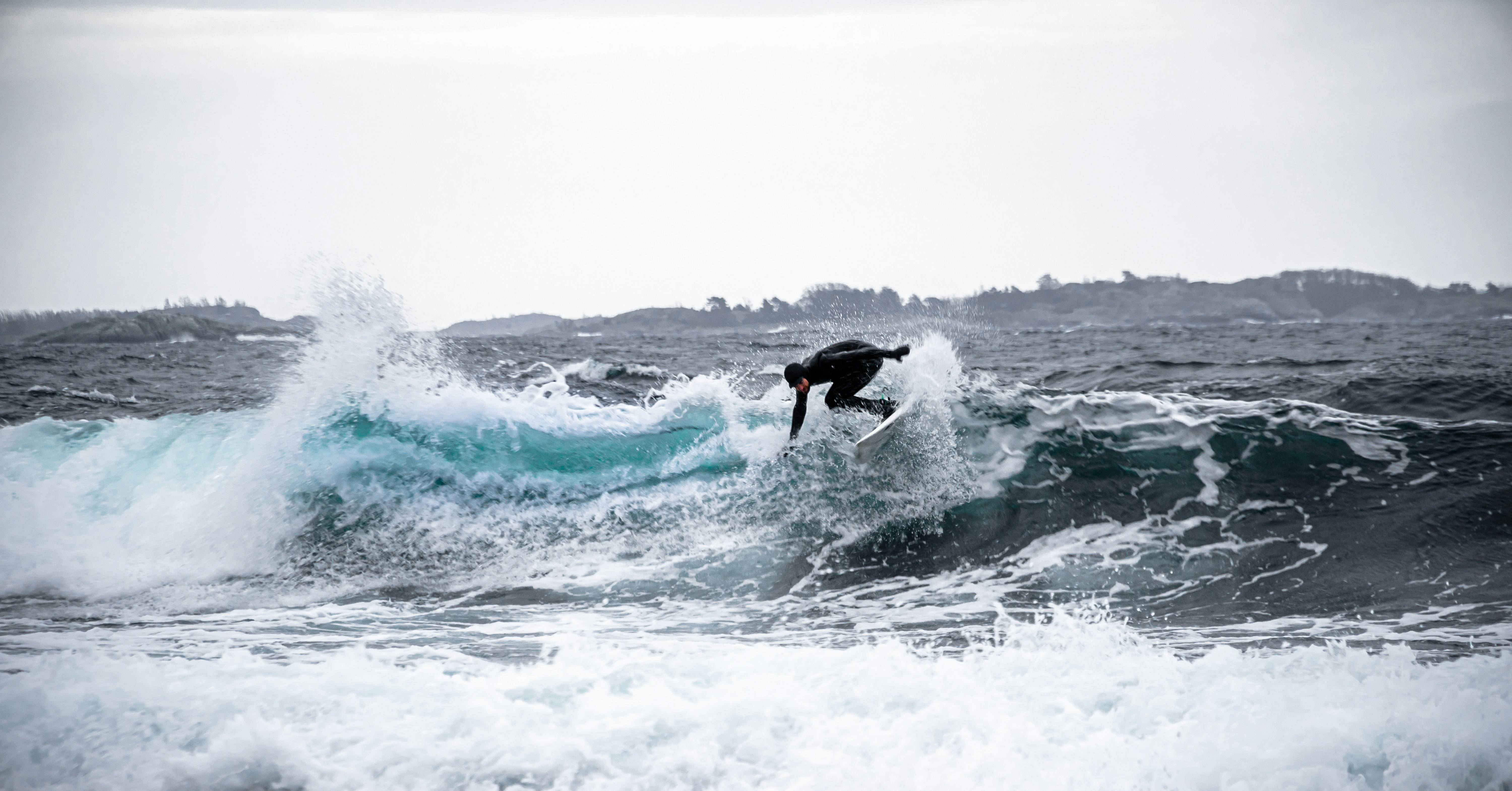 Crestbound: Surfer Pivot on a Blue Mountain