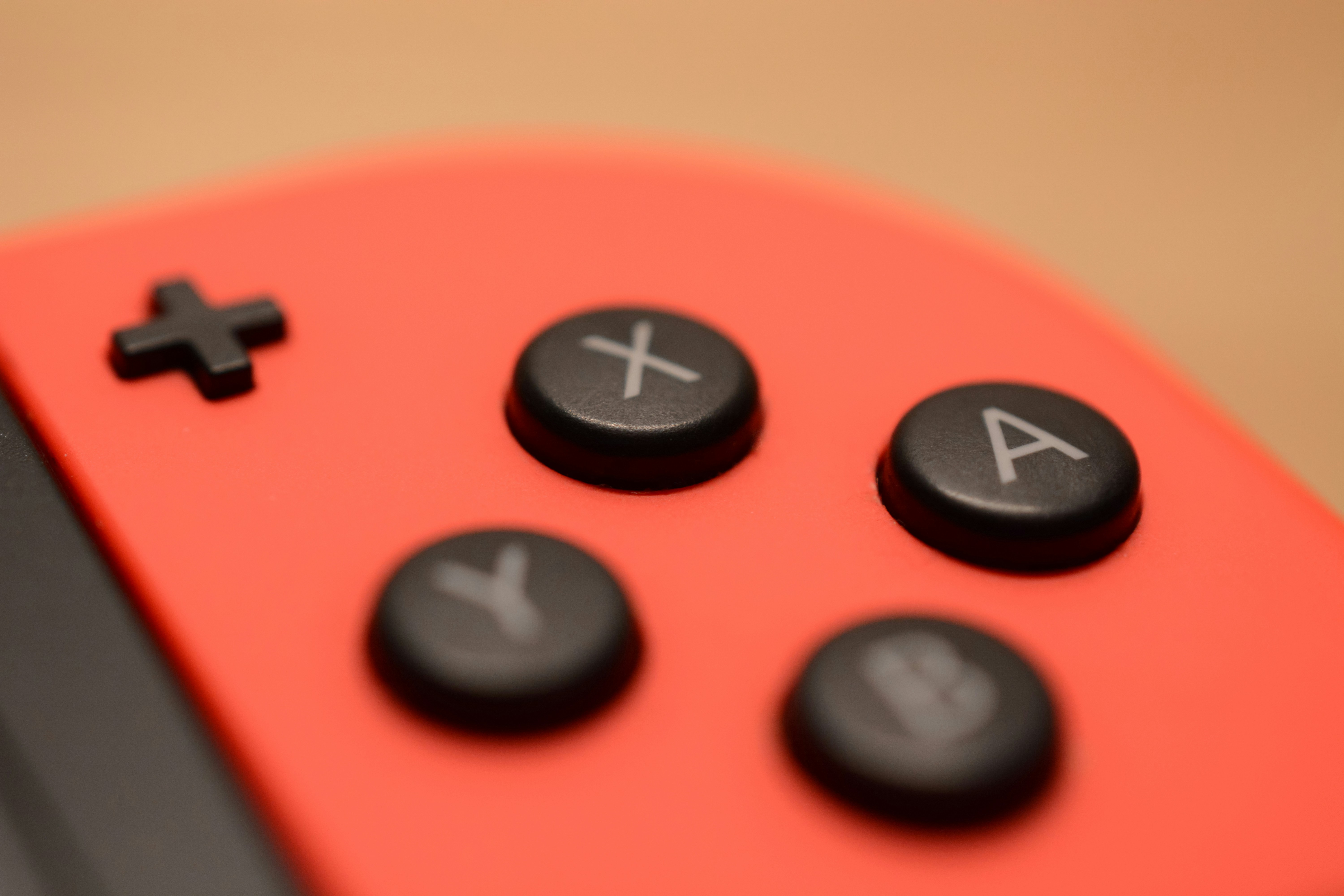 Red and black remote control photo – Free Game Image on Unsplash