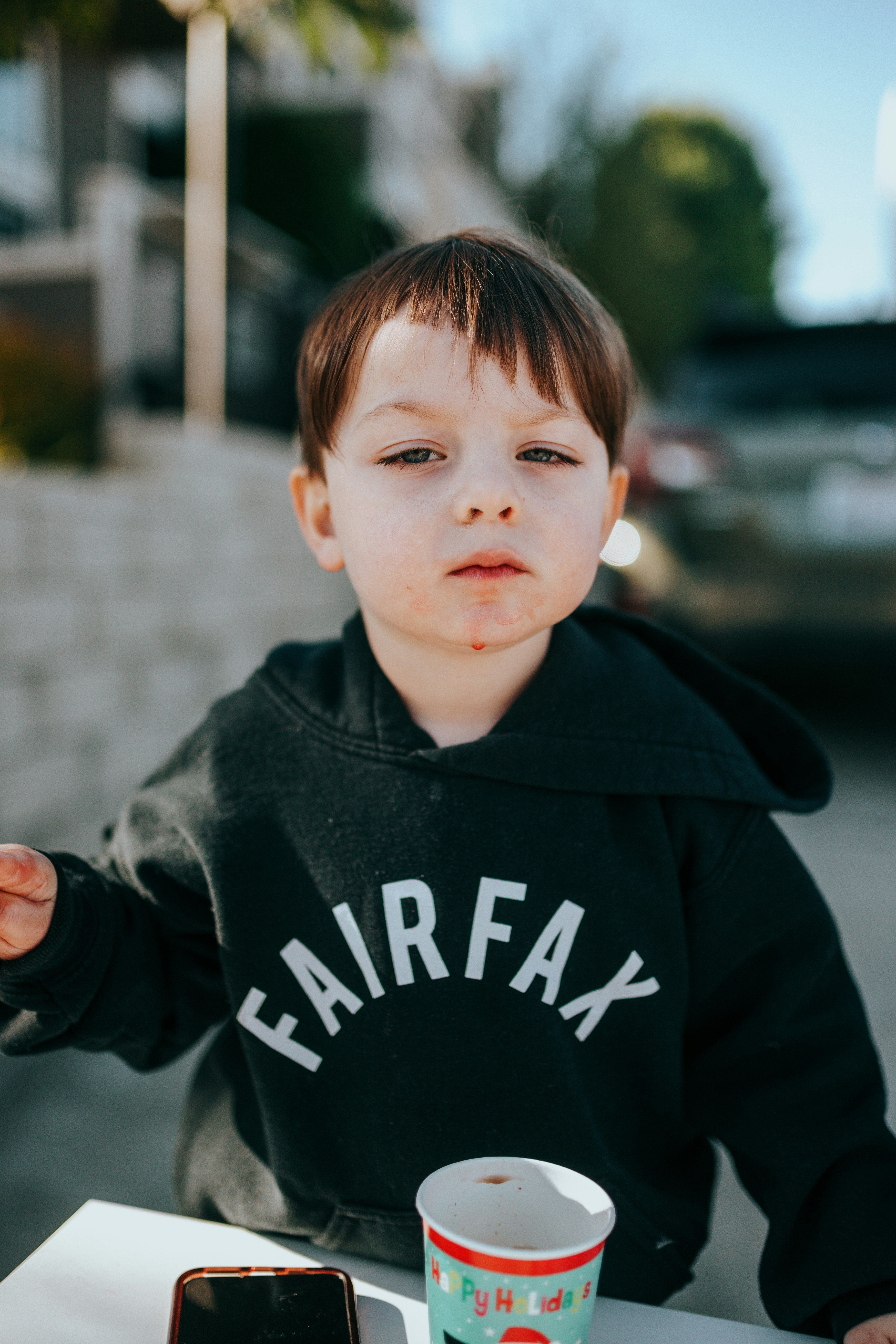 Child's Curious Gaze at the Outdoor Table