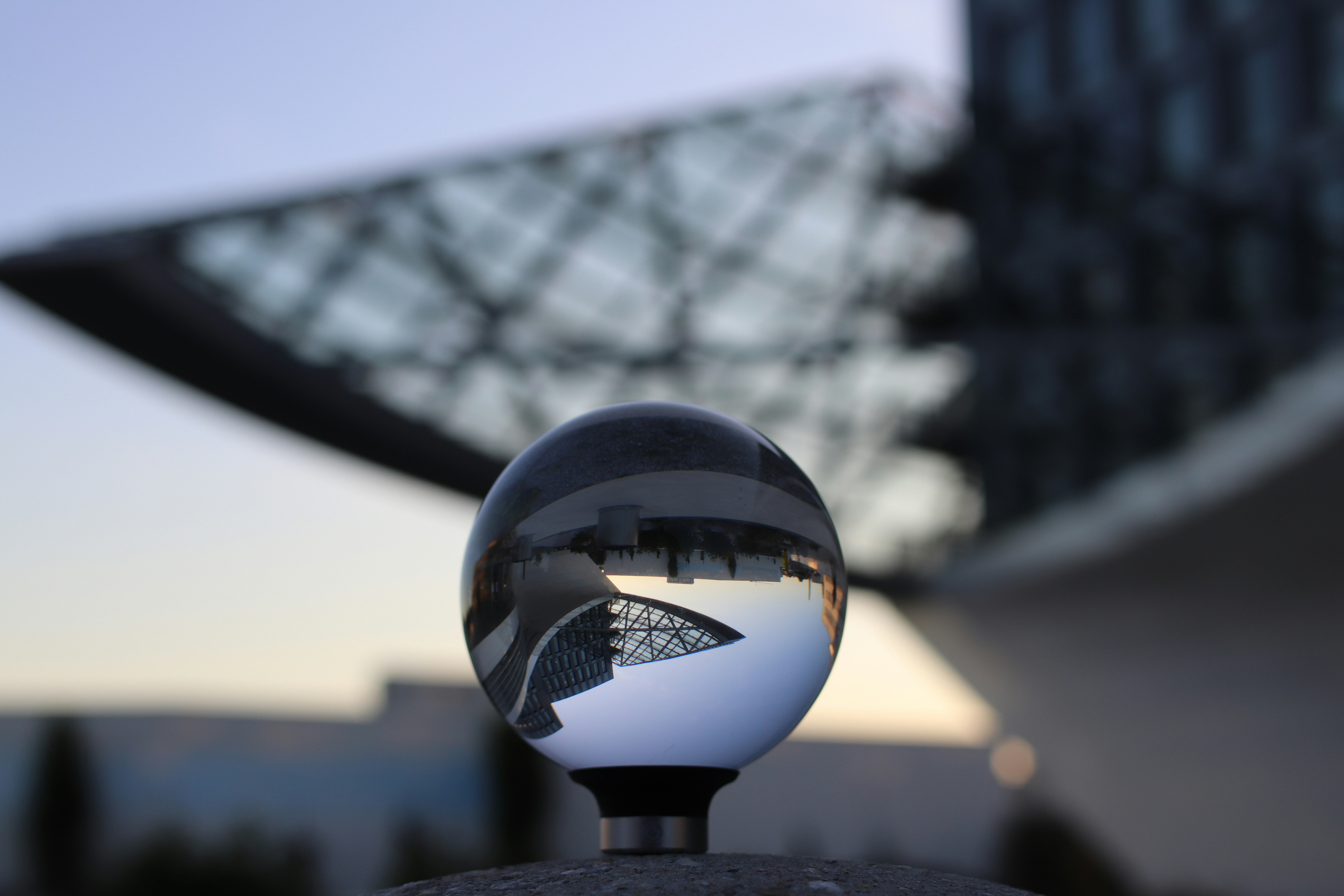 Reflective Sphere Overlooking Modern Architecture