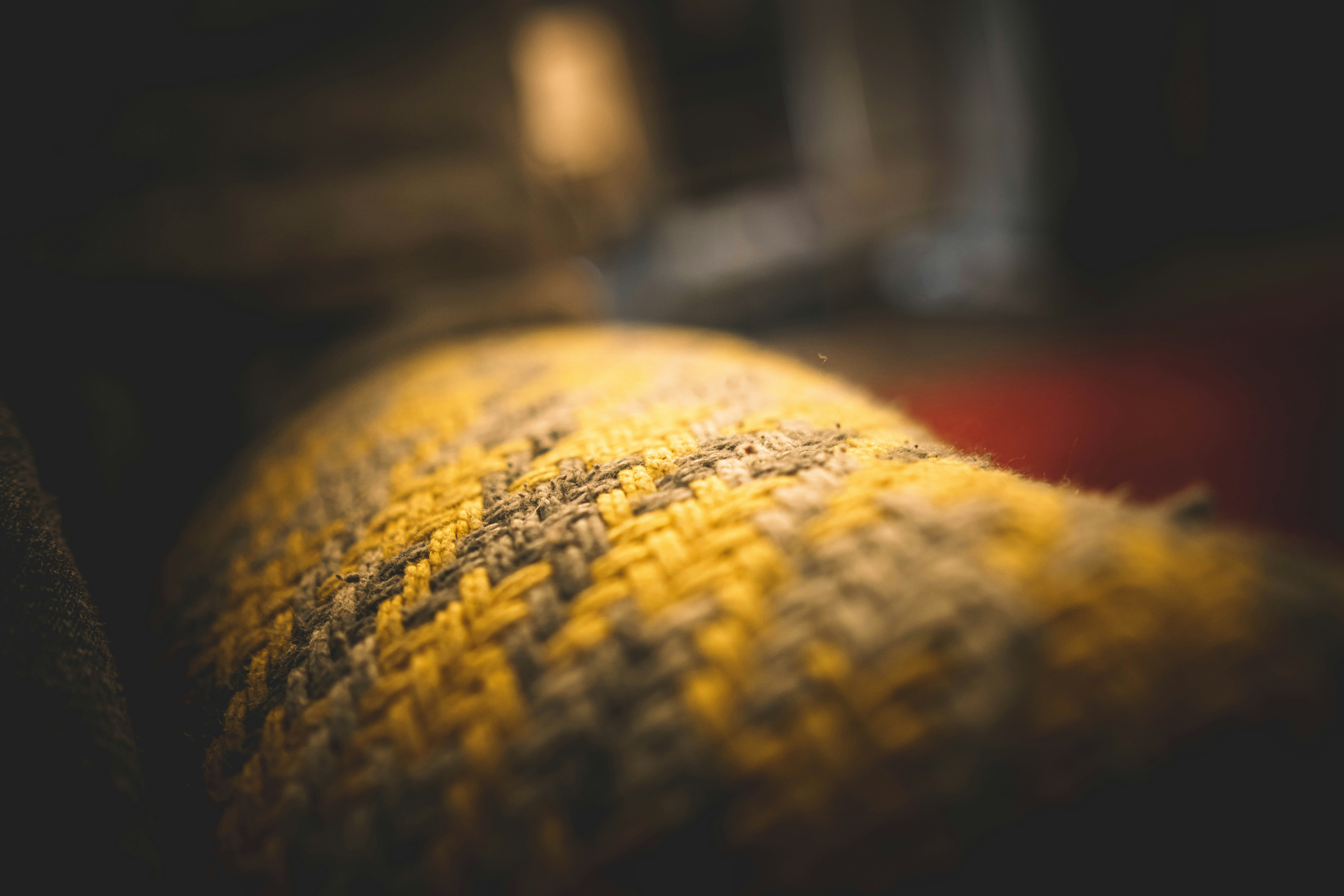 Amber Threads in Focus: Macro Portrait of Woven Texture