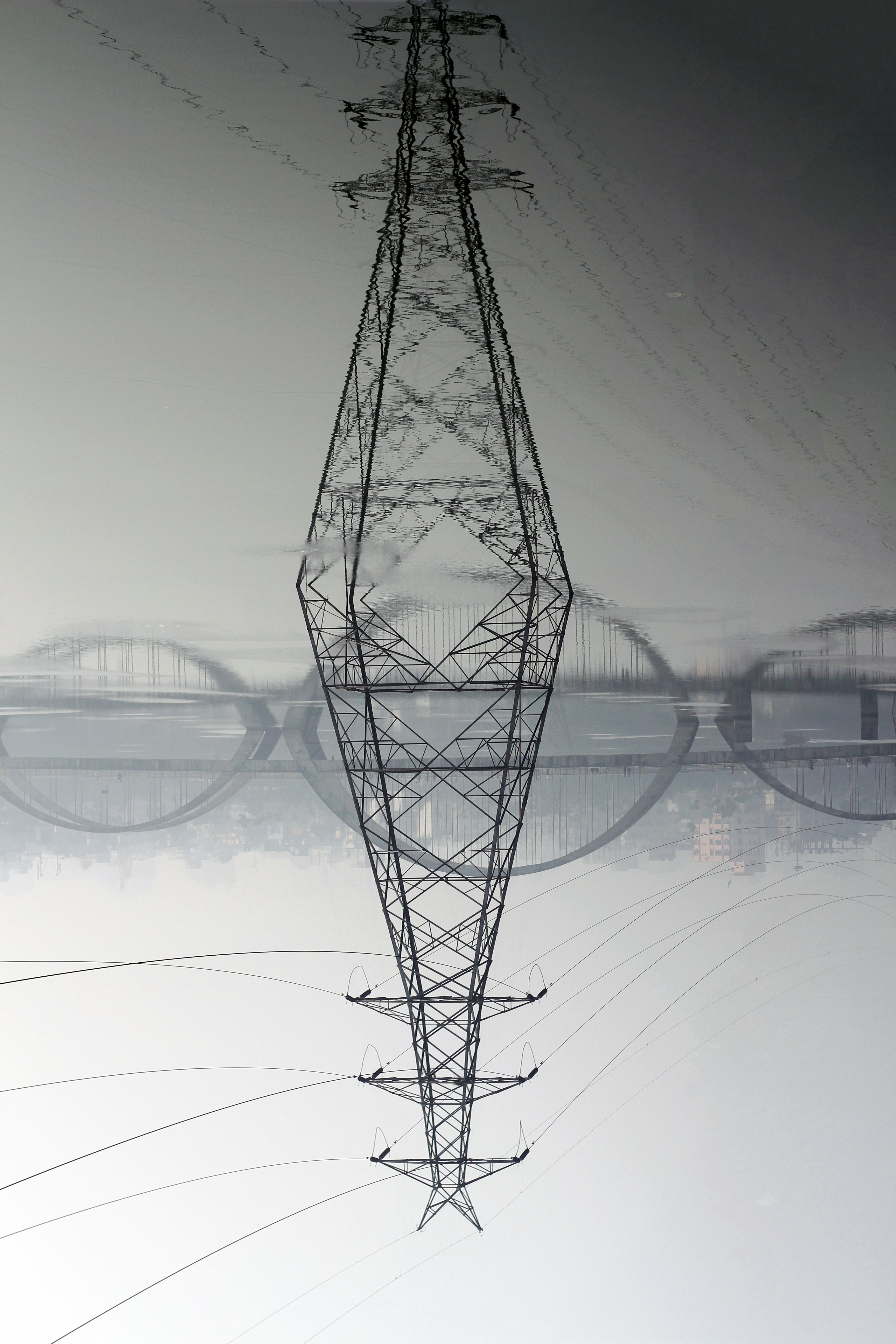 Diamond Lattice Tower: Monochrome Geometry Over the River