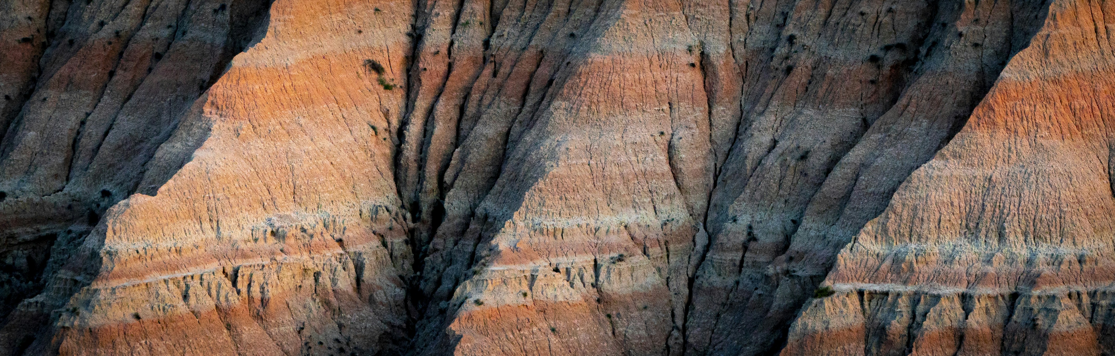 Ribboned Canyon: Sunlit Strata Carving through Shadowed Cliffs