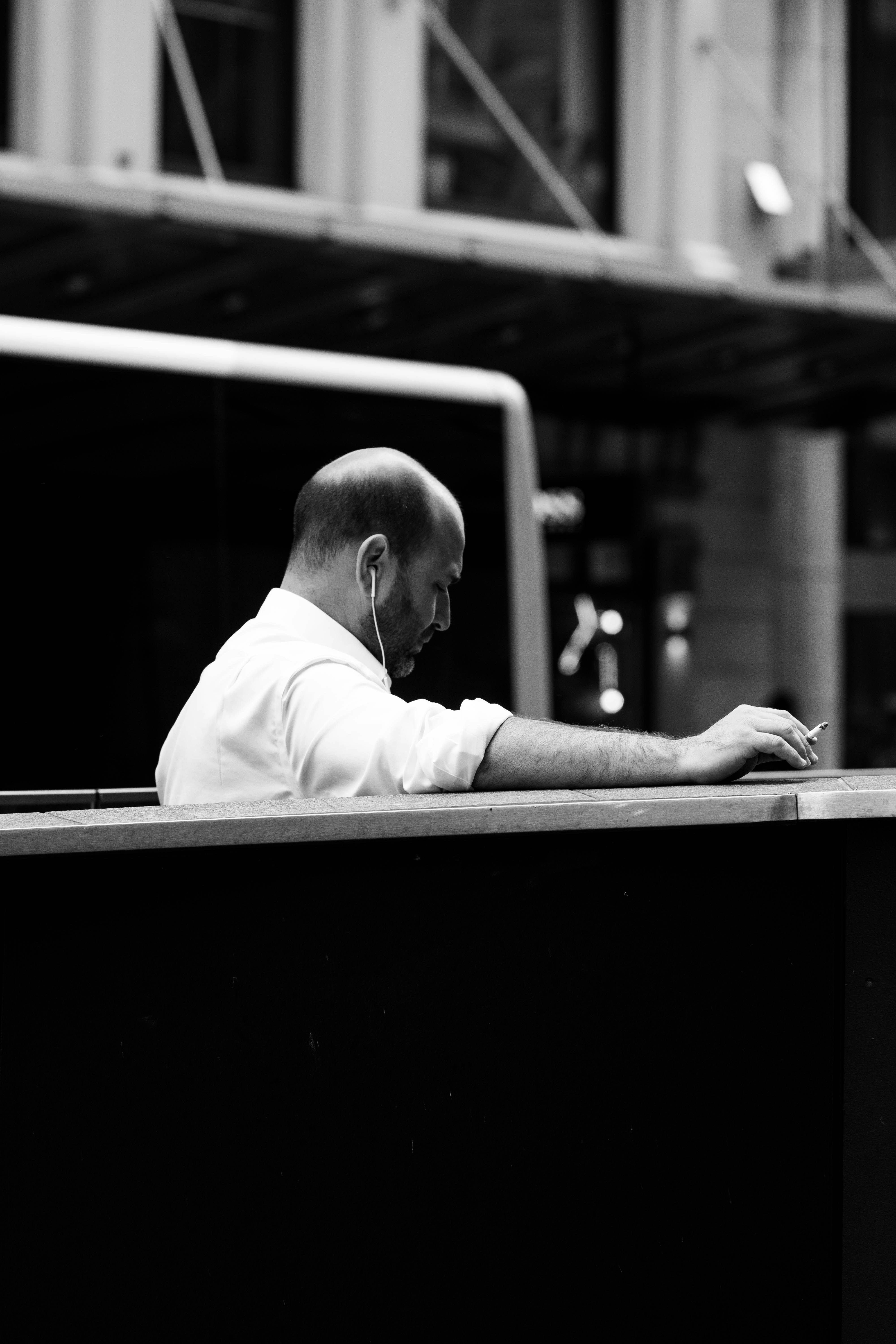 grayscale photo of man in white dress shirt