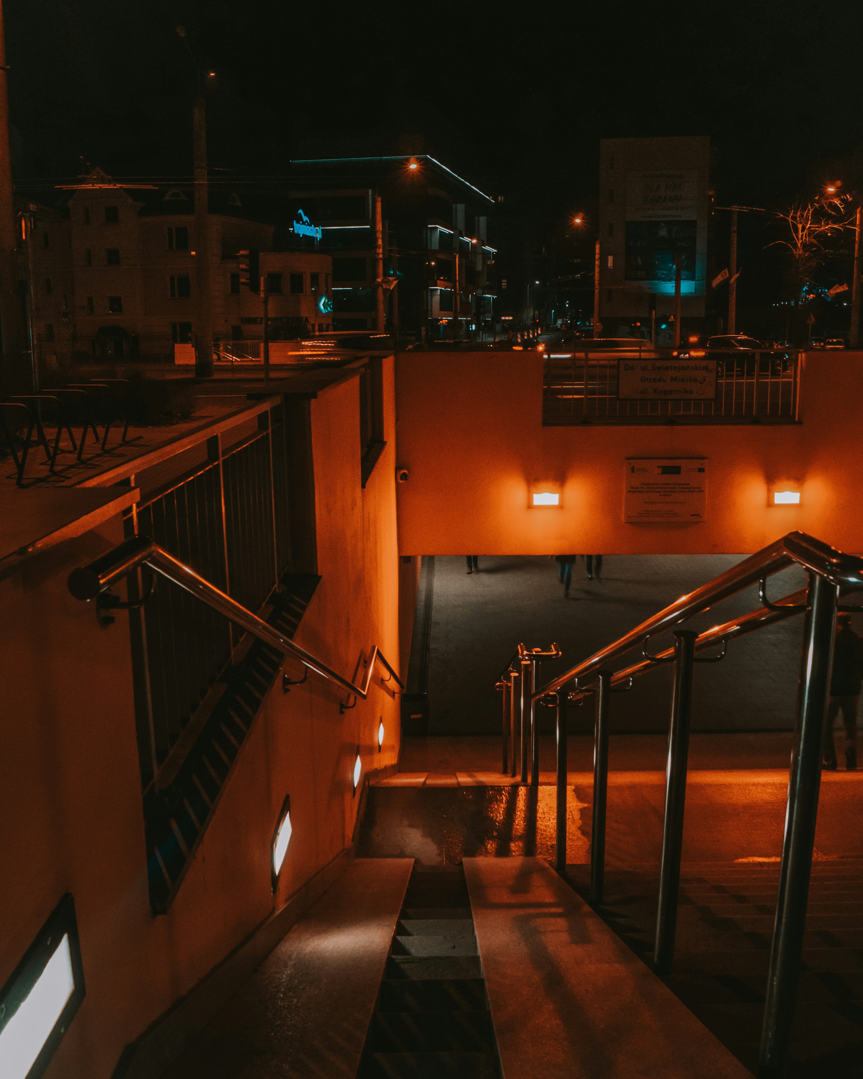 Amber Descent: A Night Staircase into the City’s Warm Underpass