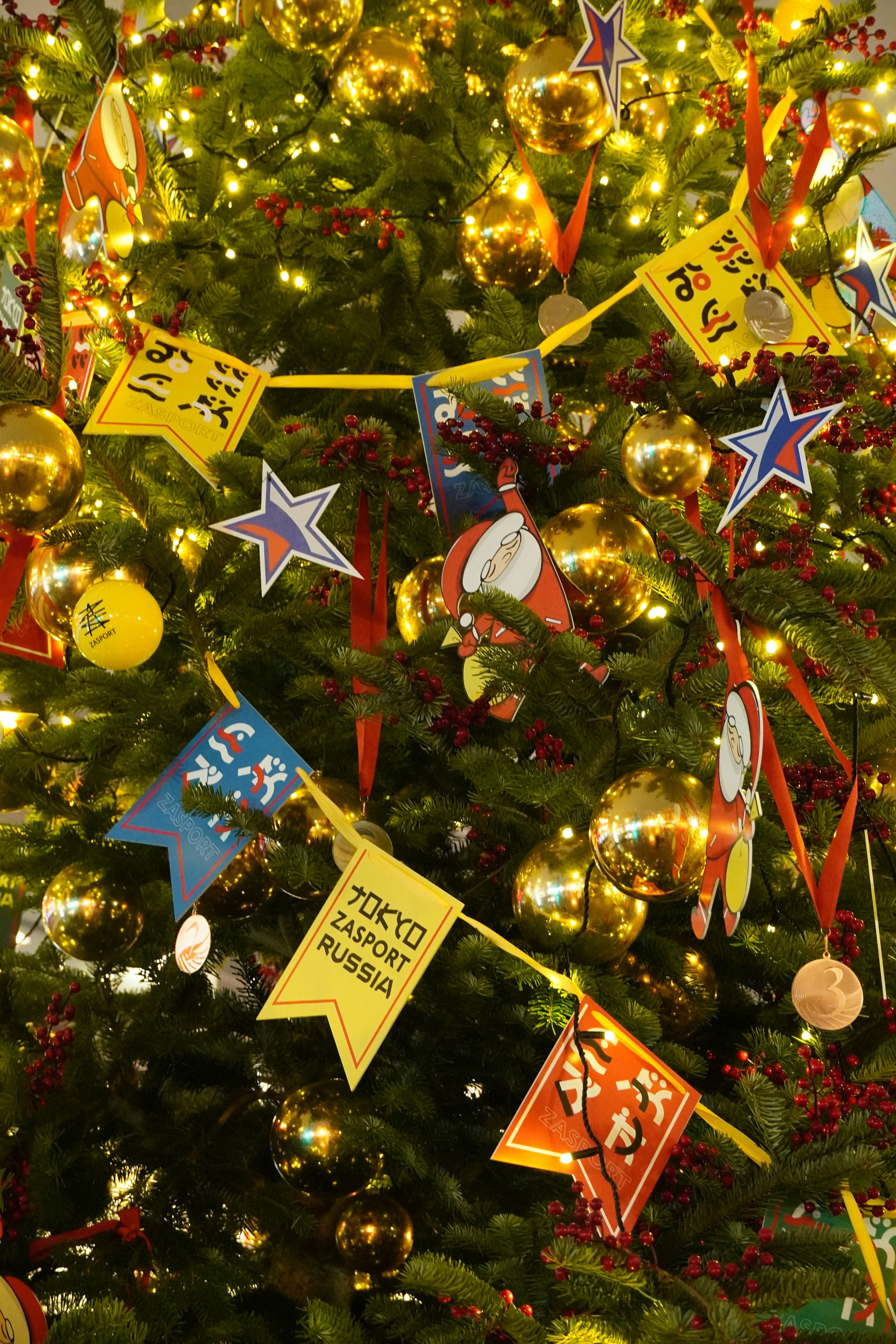 Global Yuletide on a Branch: A Christmas Tree Woven with Travel Pennants and Santa