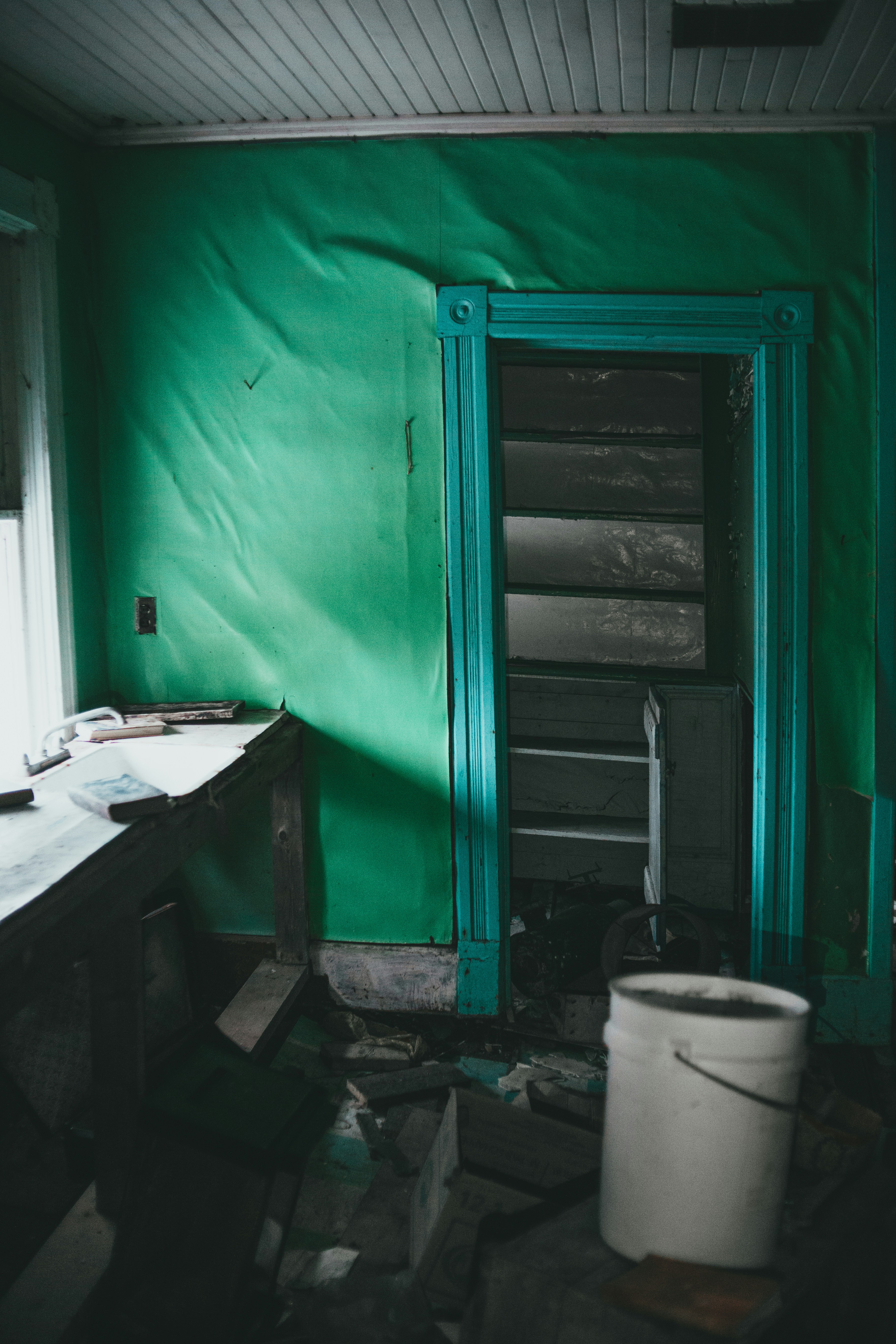 Teal Threshold: An Abandoned Green Room's Quiet Decay