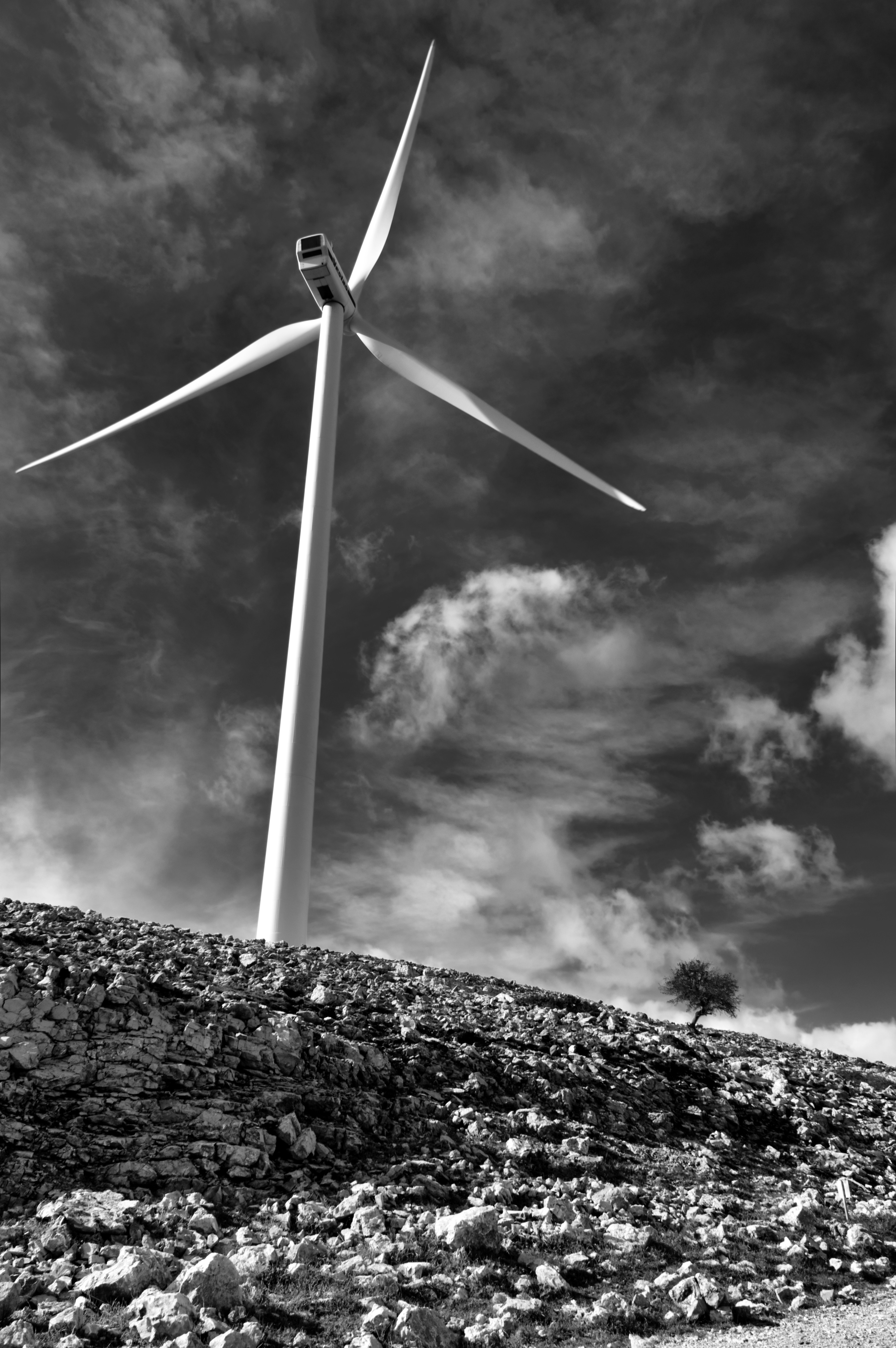 Giant Windmill on a Rocky Slope Under a Dynamic Sky