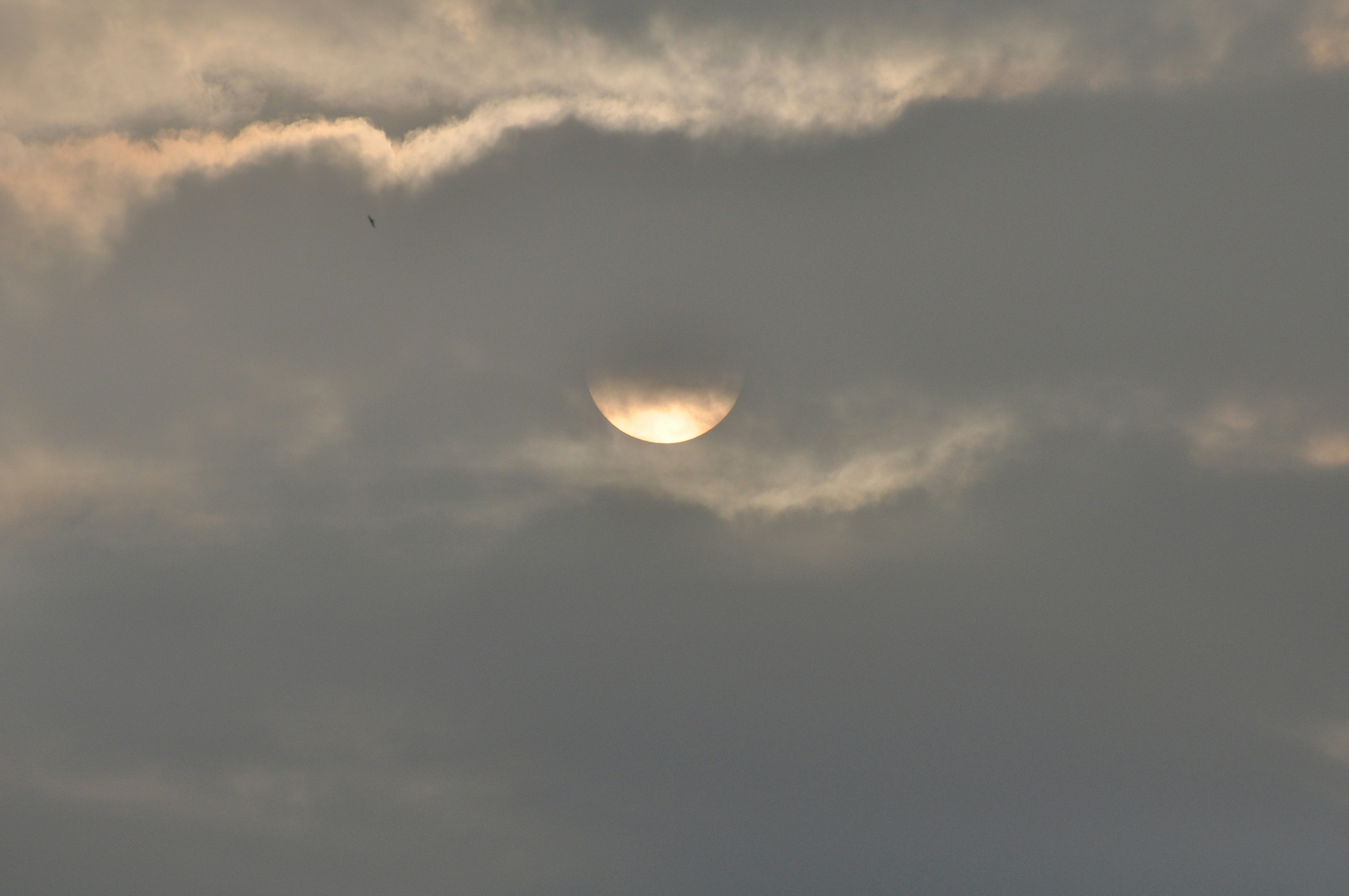 full moon covered by clouds