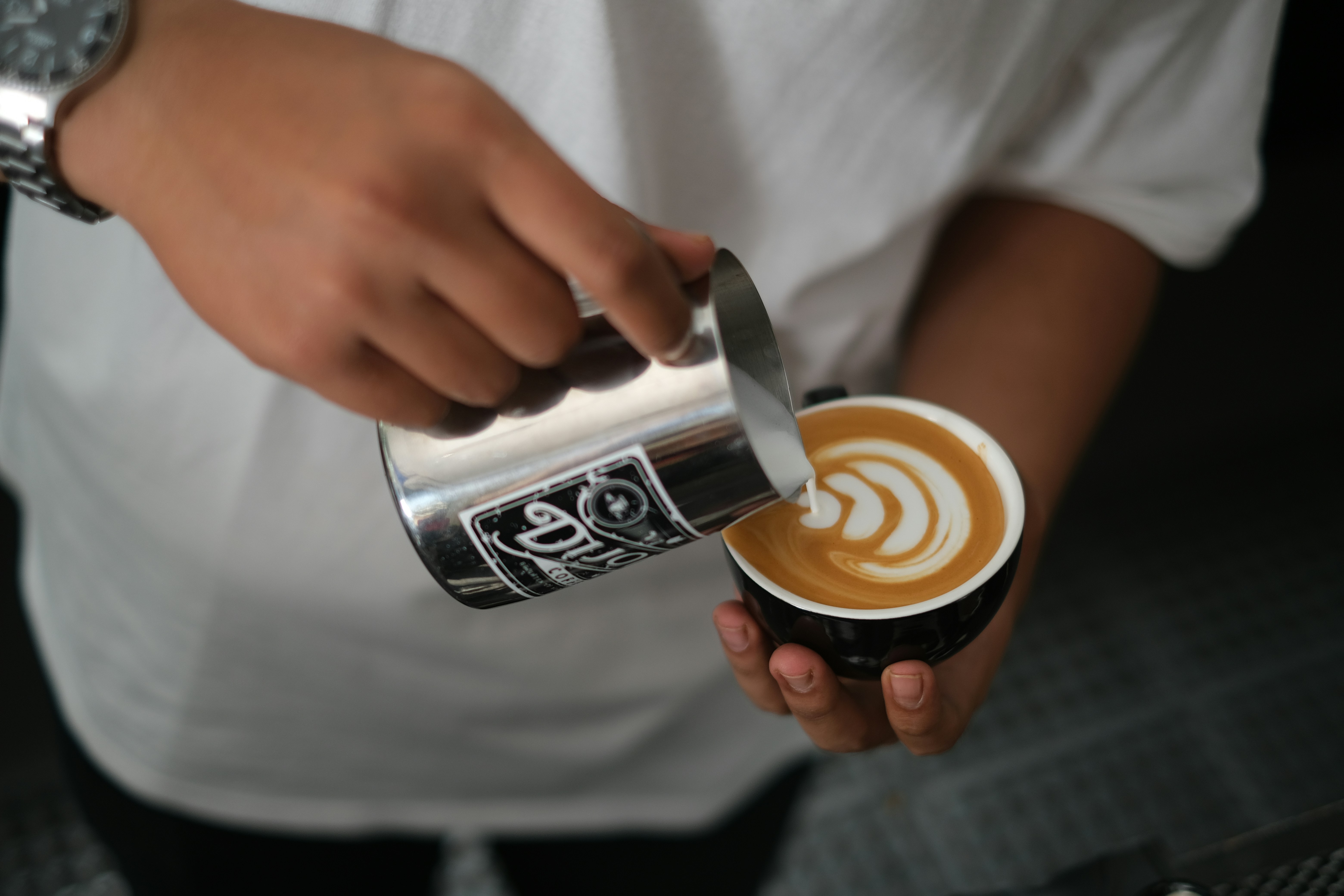 Steam and Silk: Latte Art Unfolds in a Barista's Pour
