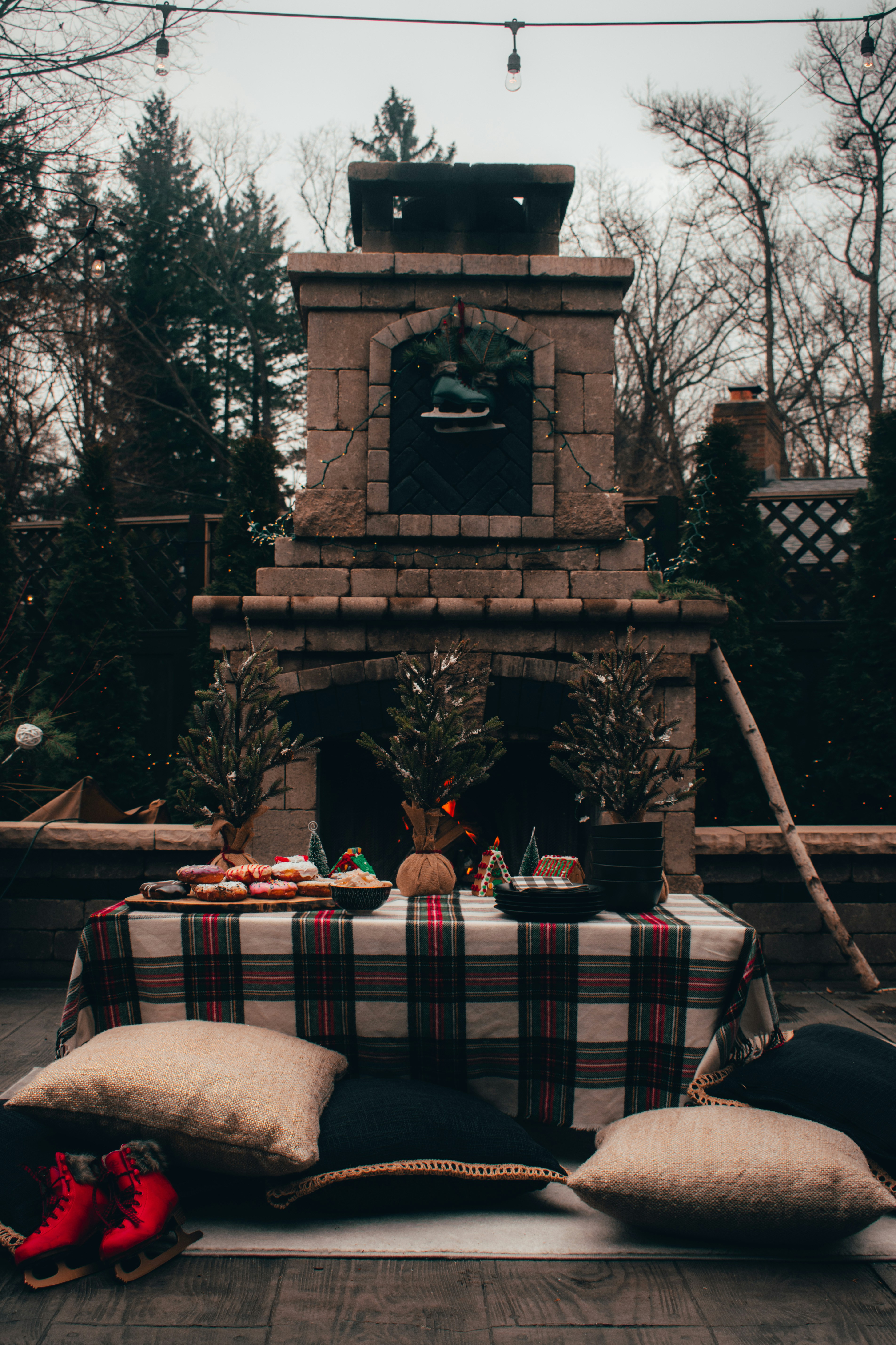 Cozy Outdoor Holiday Setup in Front of Stone Fireplace
