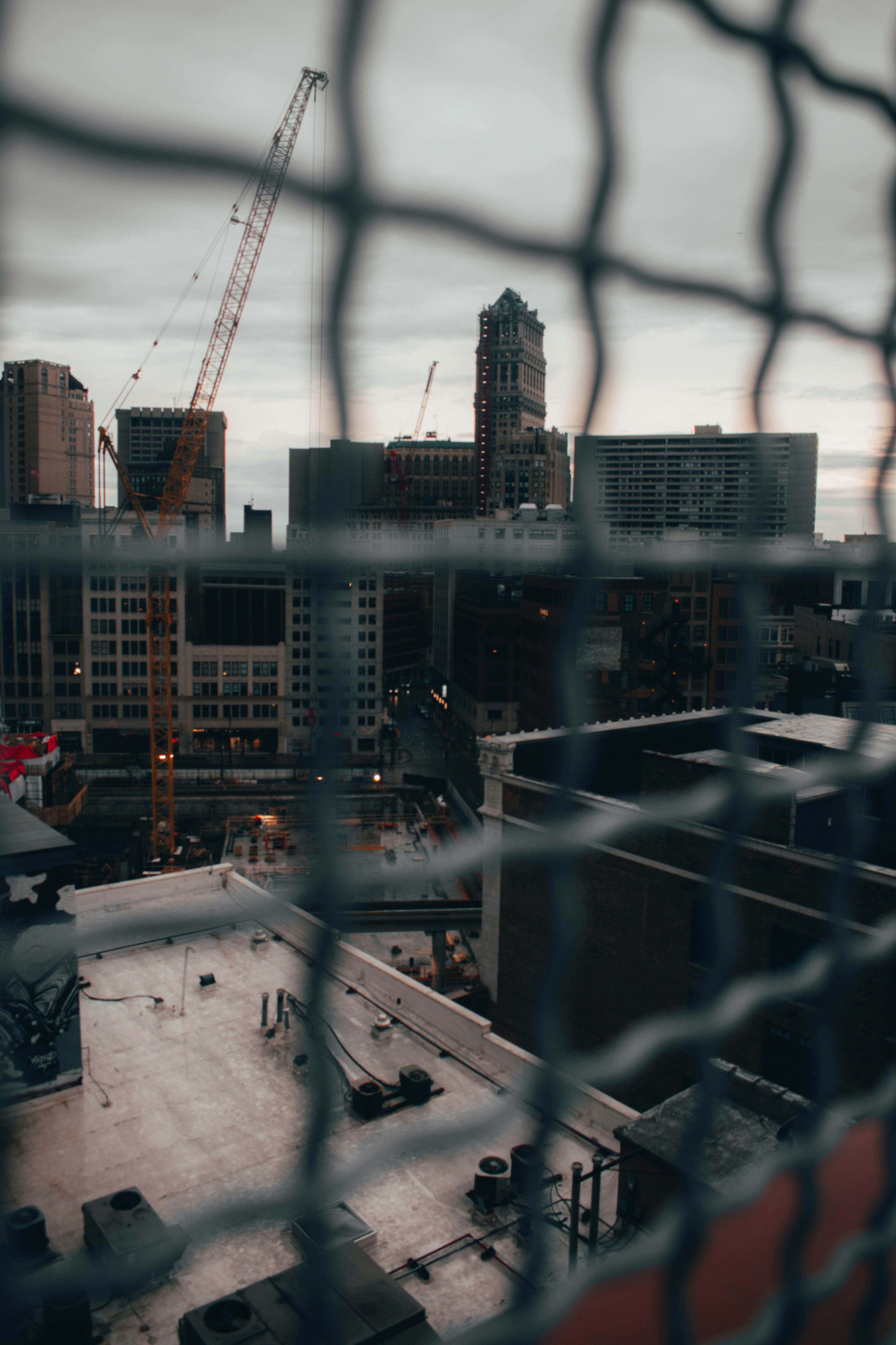 Black metal fence near high rise buildings during daytime photo – Free ...