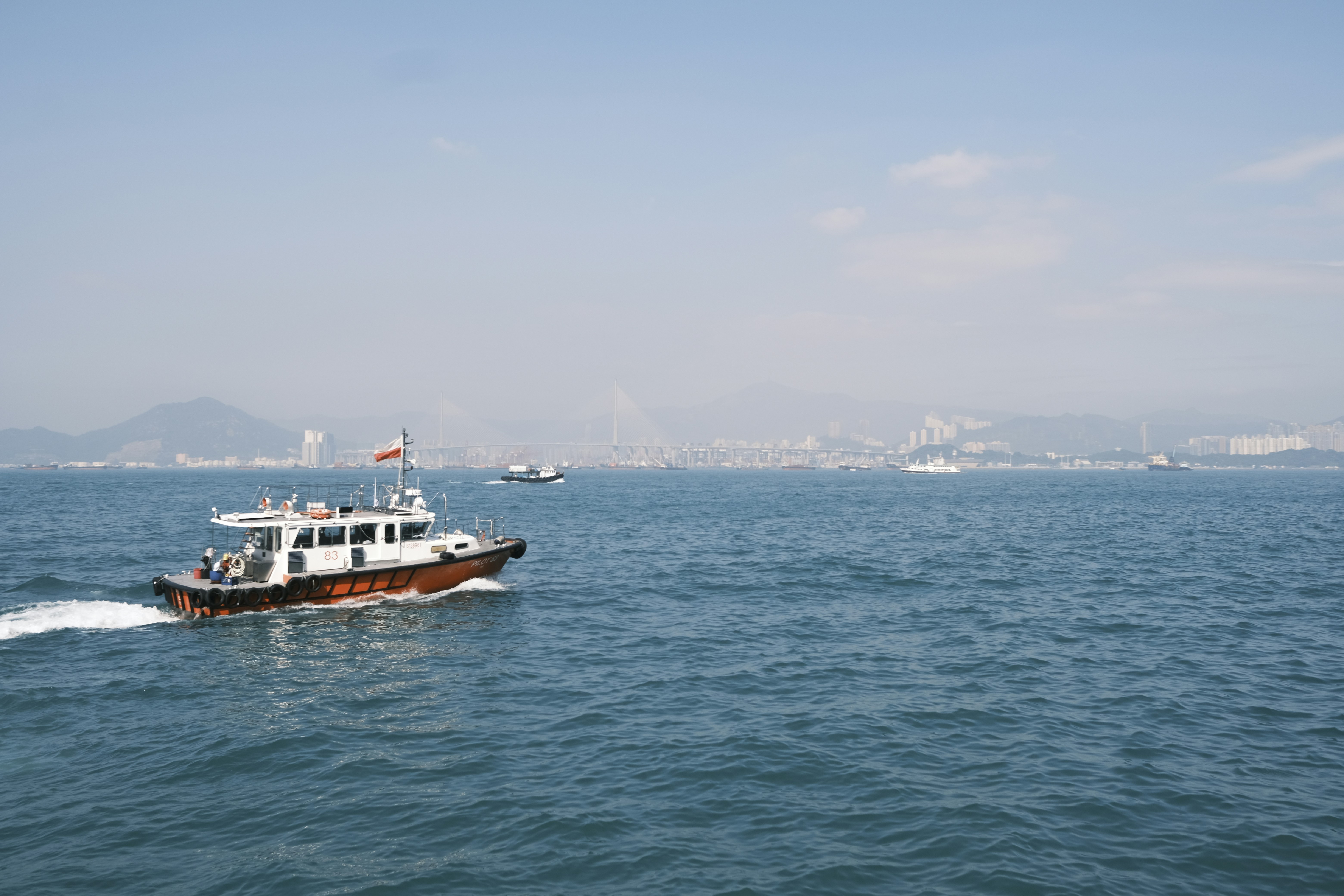 white and brown boat on sea during daytime