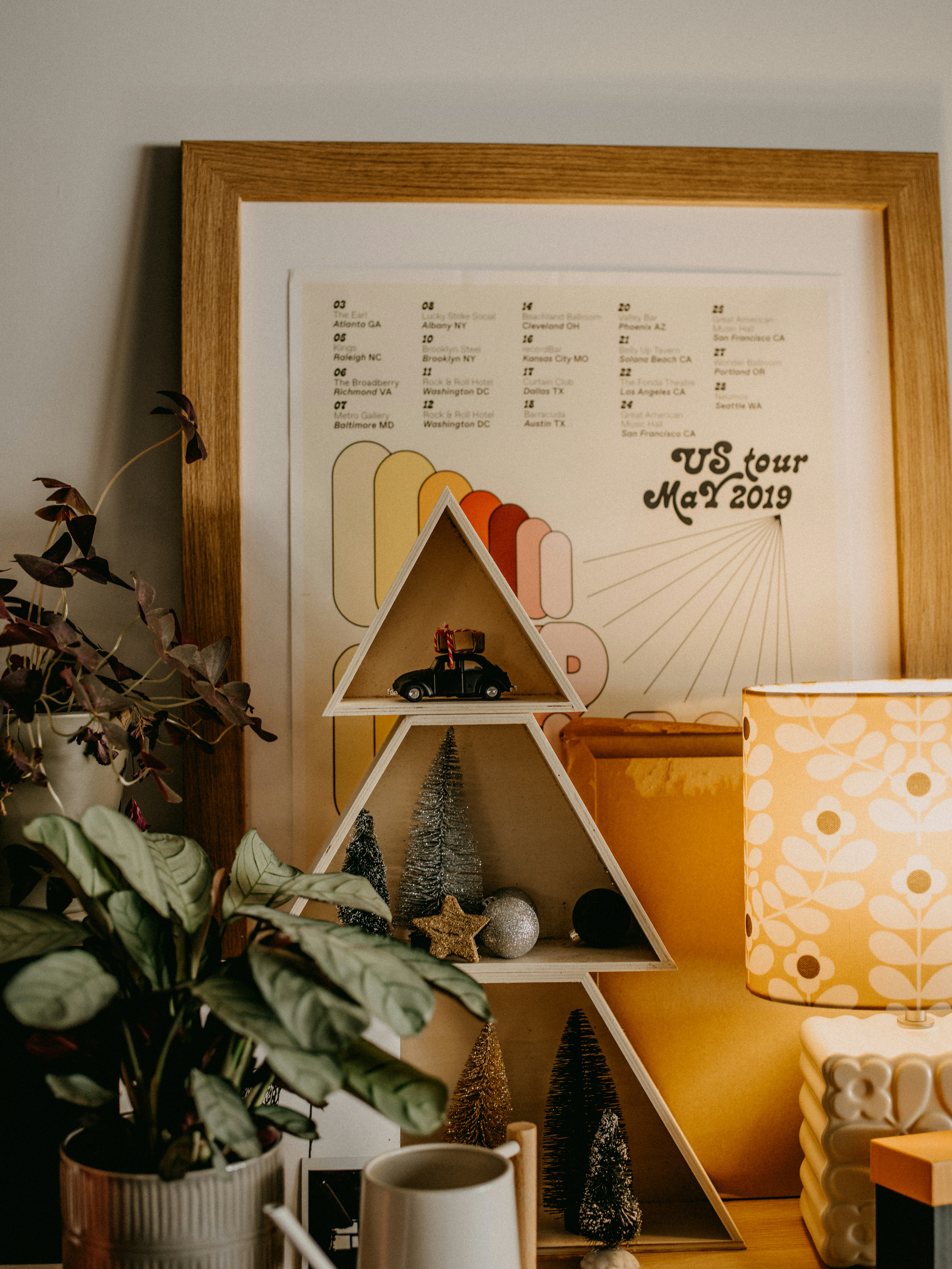 Miniature Christmas Tree Display Framed by Warm Glow
