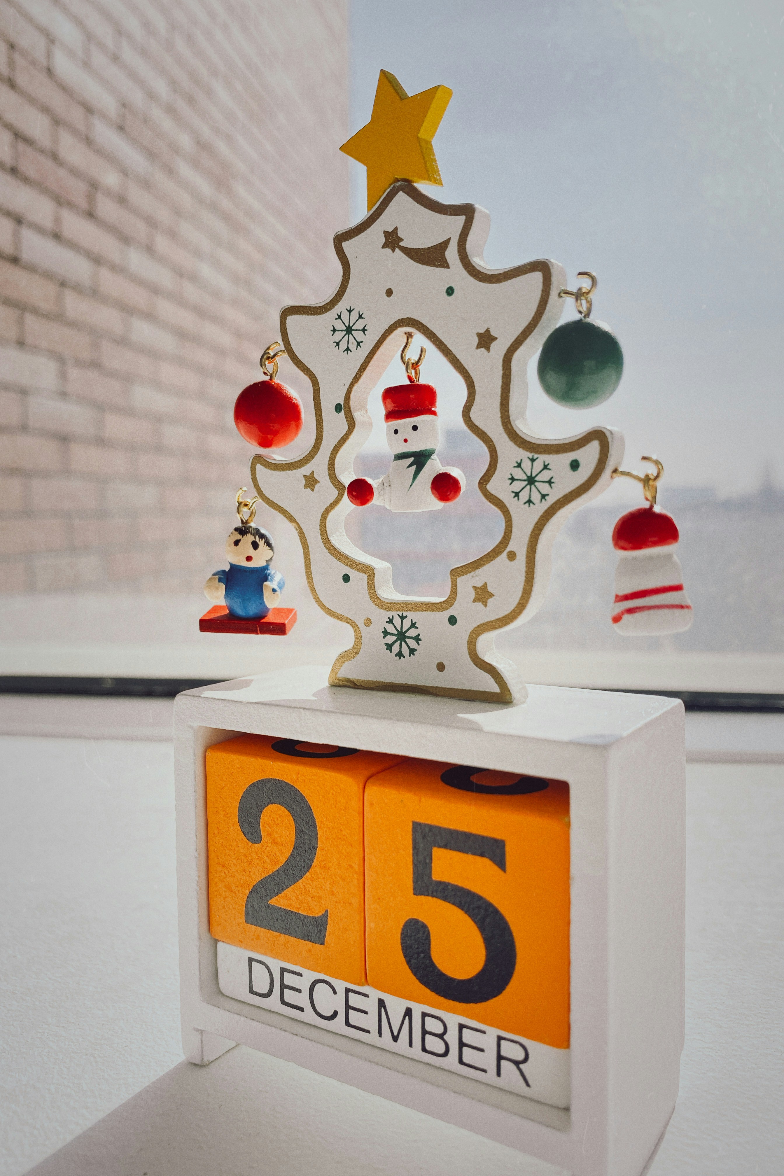 Mini Christmas Charm: A Festive Tree with Floating Ornaments on December Display