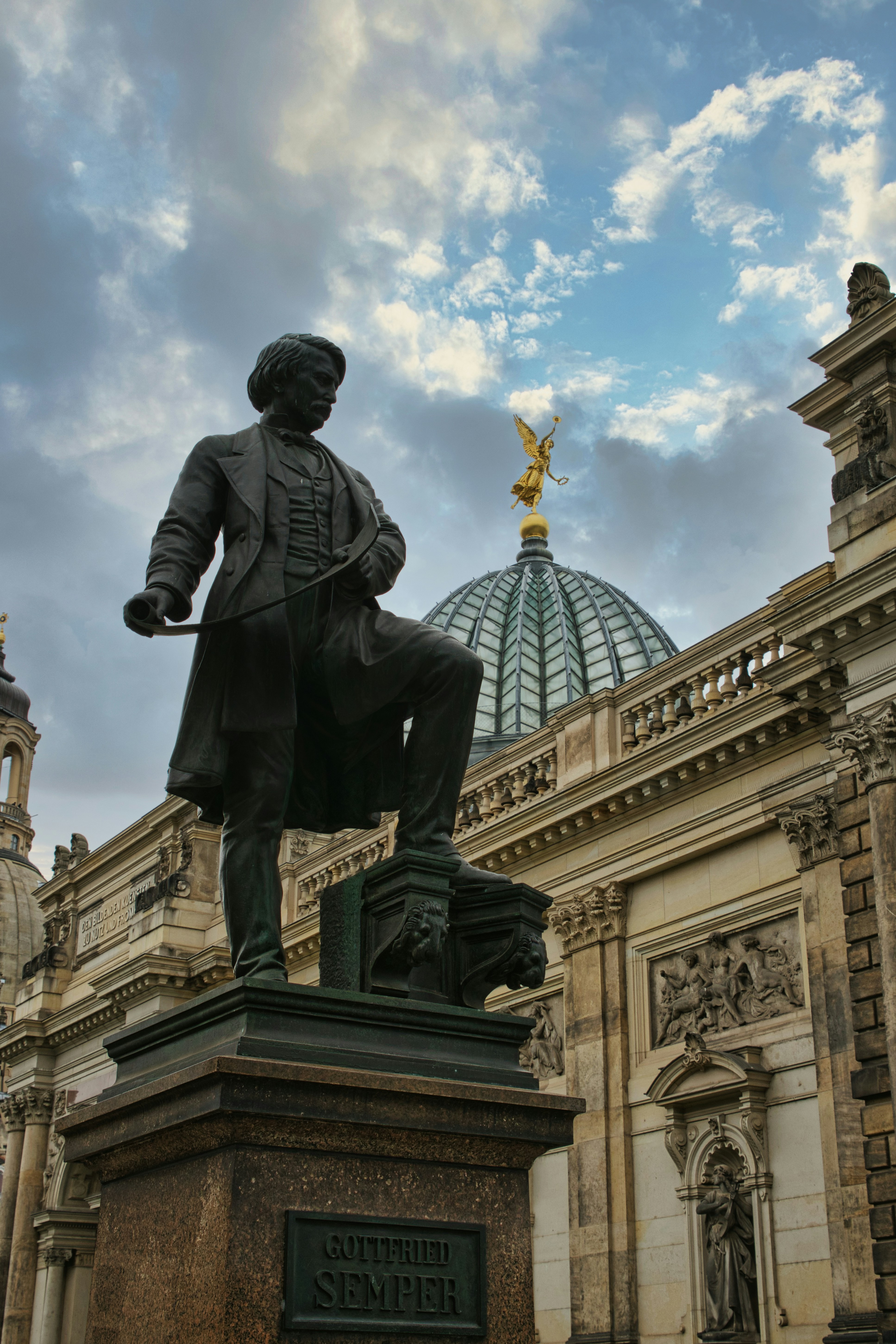 Man in black suit statue photo – Free Building Image on Unsplash