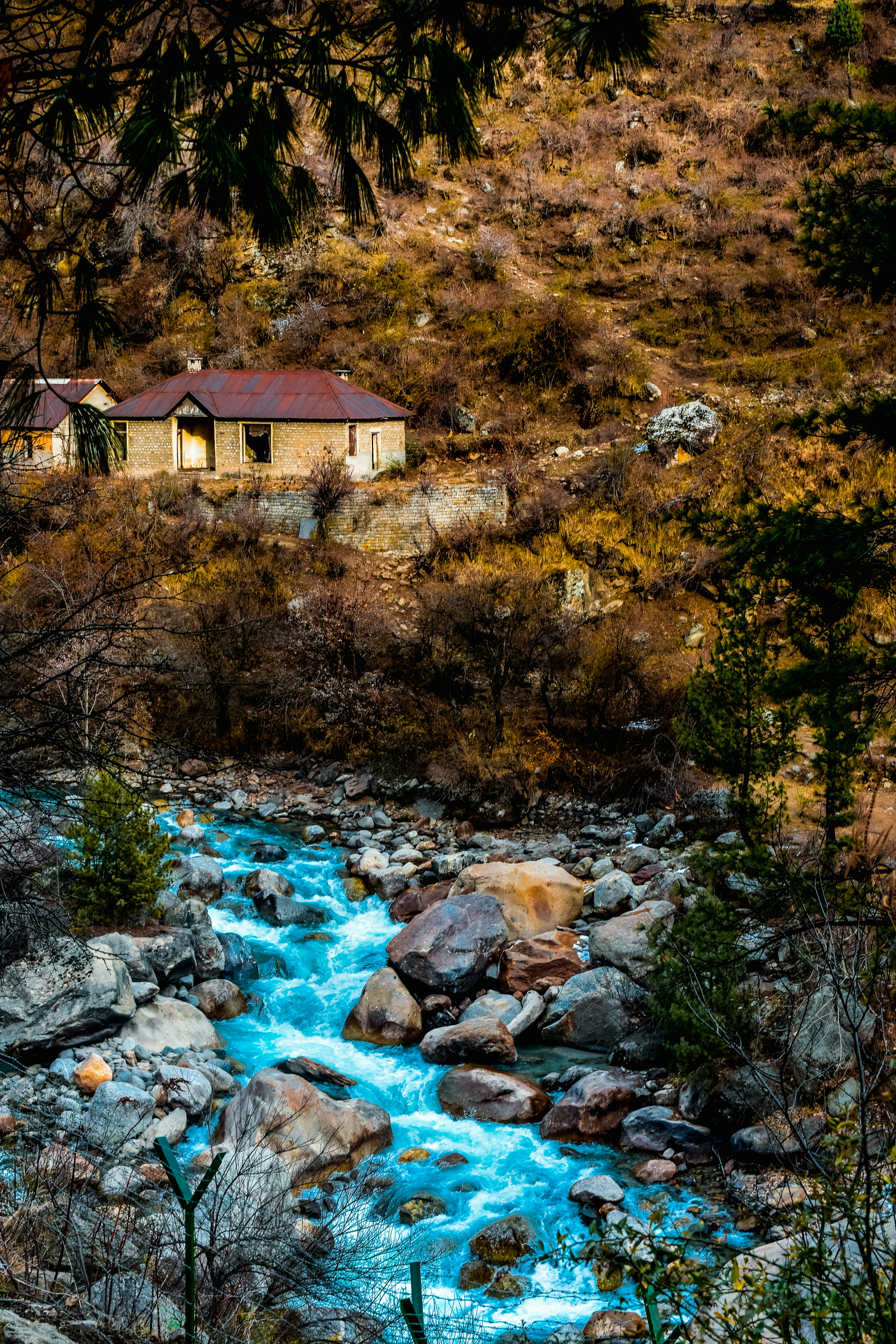 brown brick house near river