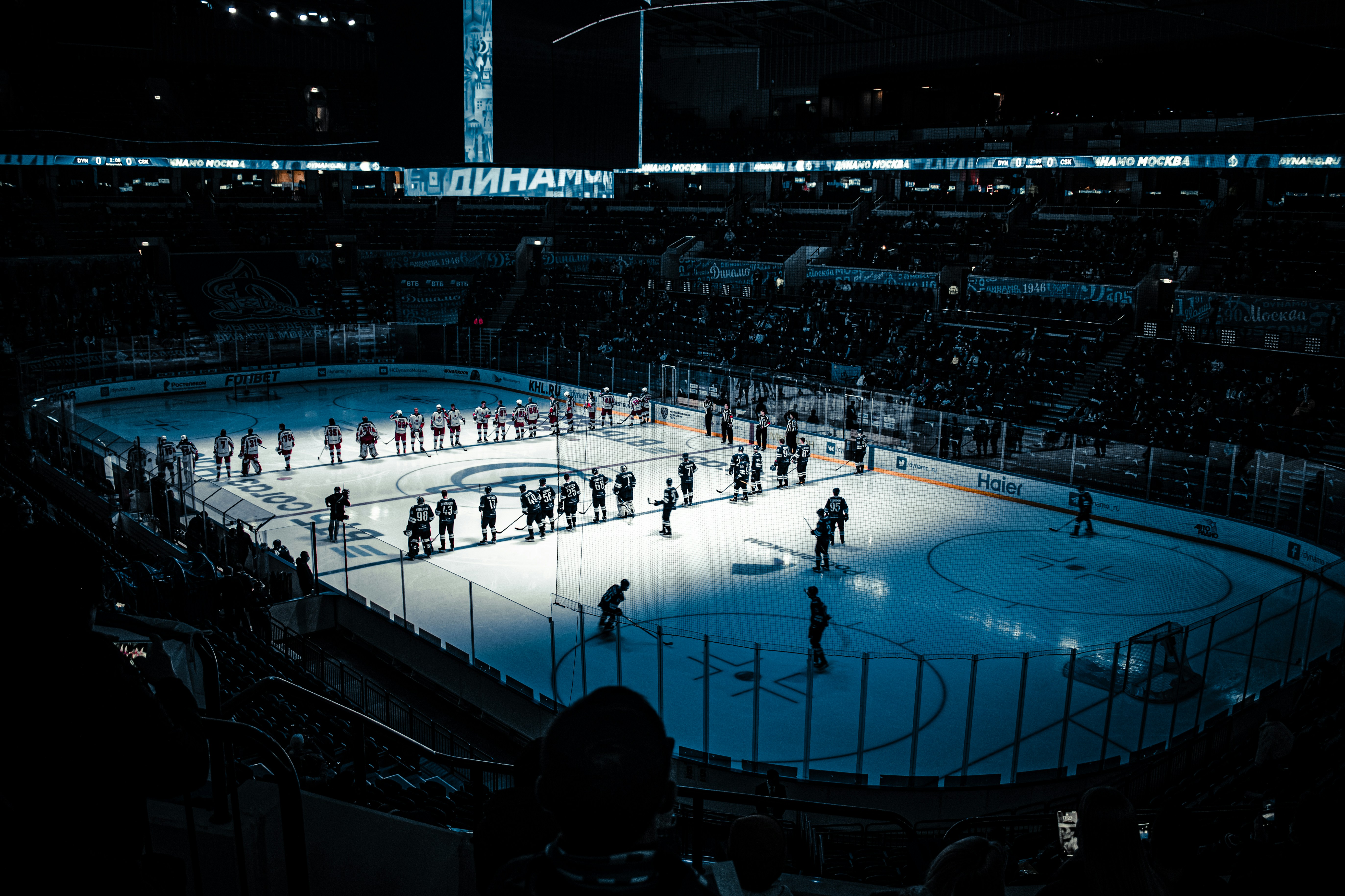 People playing basketball on ice stadium during night time photo – Free ...