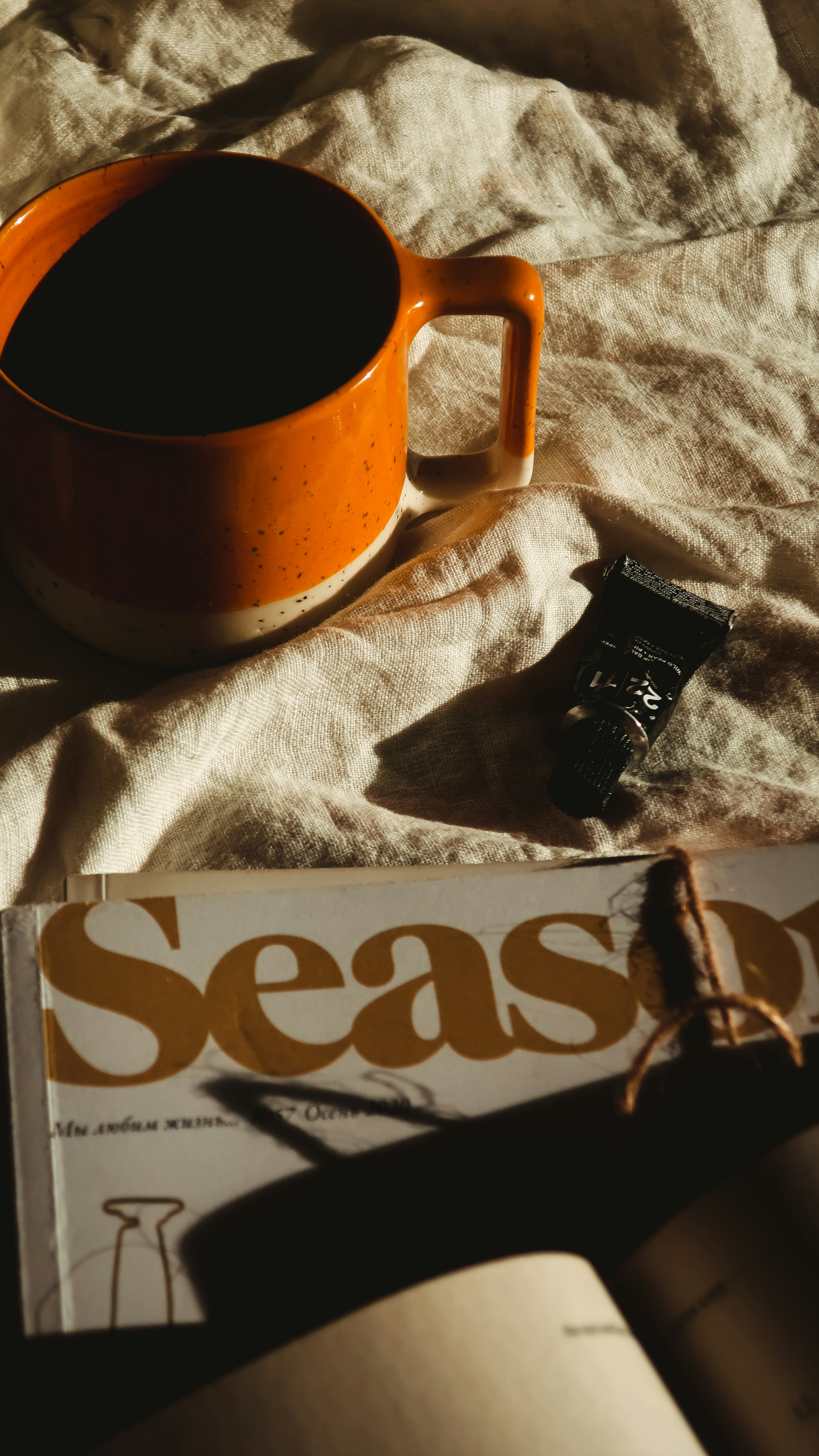 A Quiet Morning Brew: Coffee, Canvas, and a Seaside Magazine