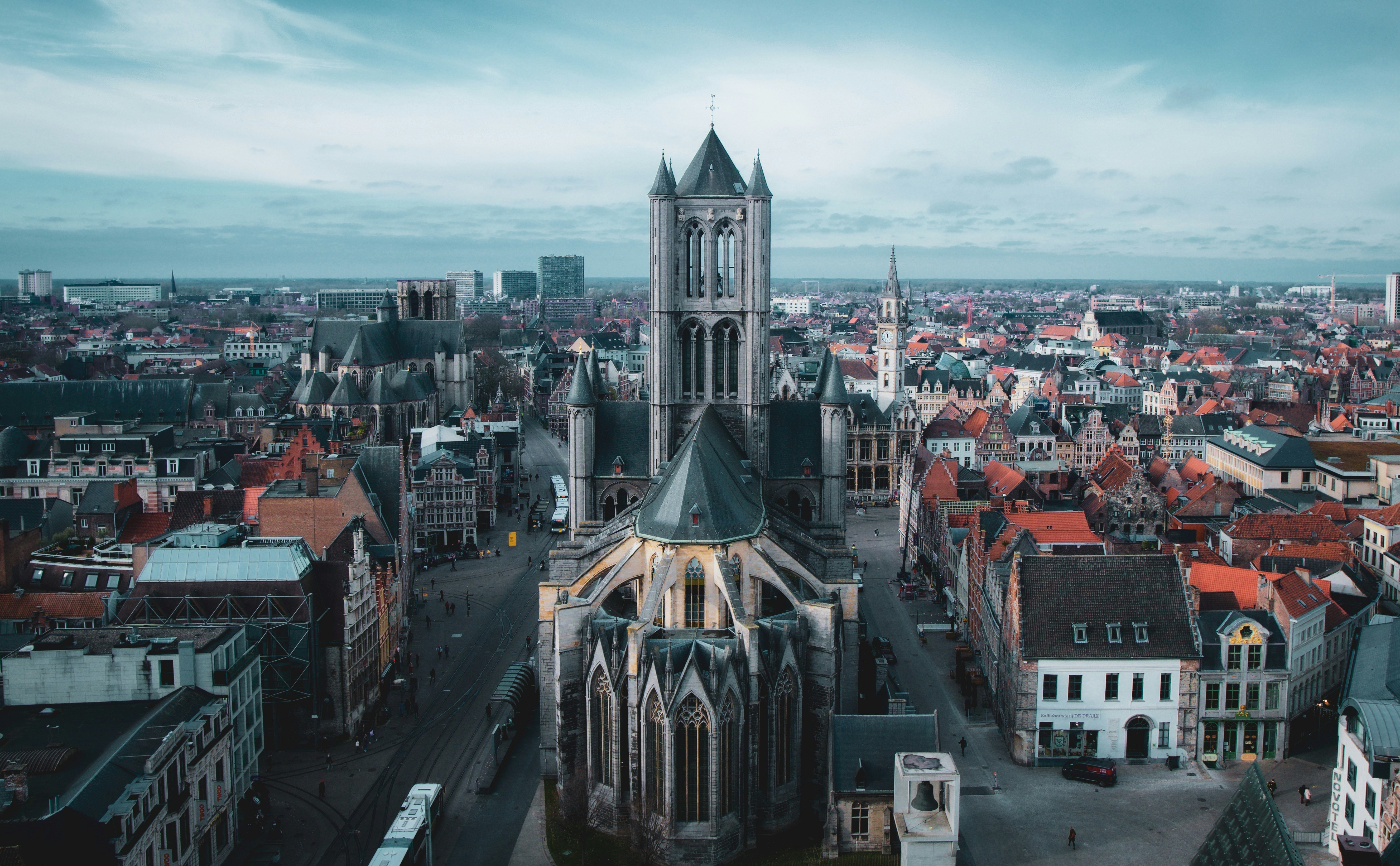 Aerial view of Sint-Niklaaskerk church amidst historic buildings in Ghent, Belgium.