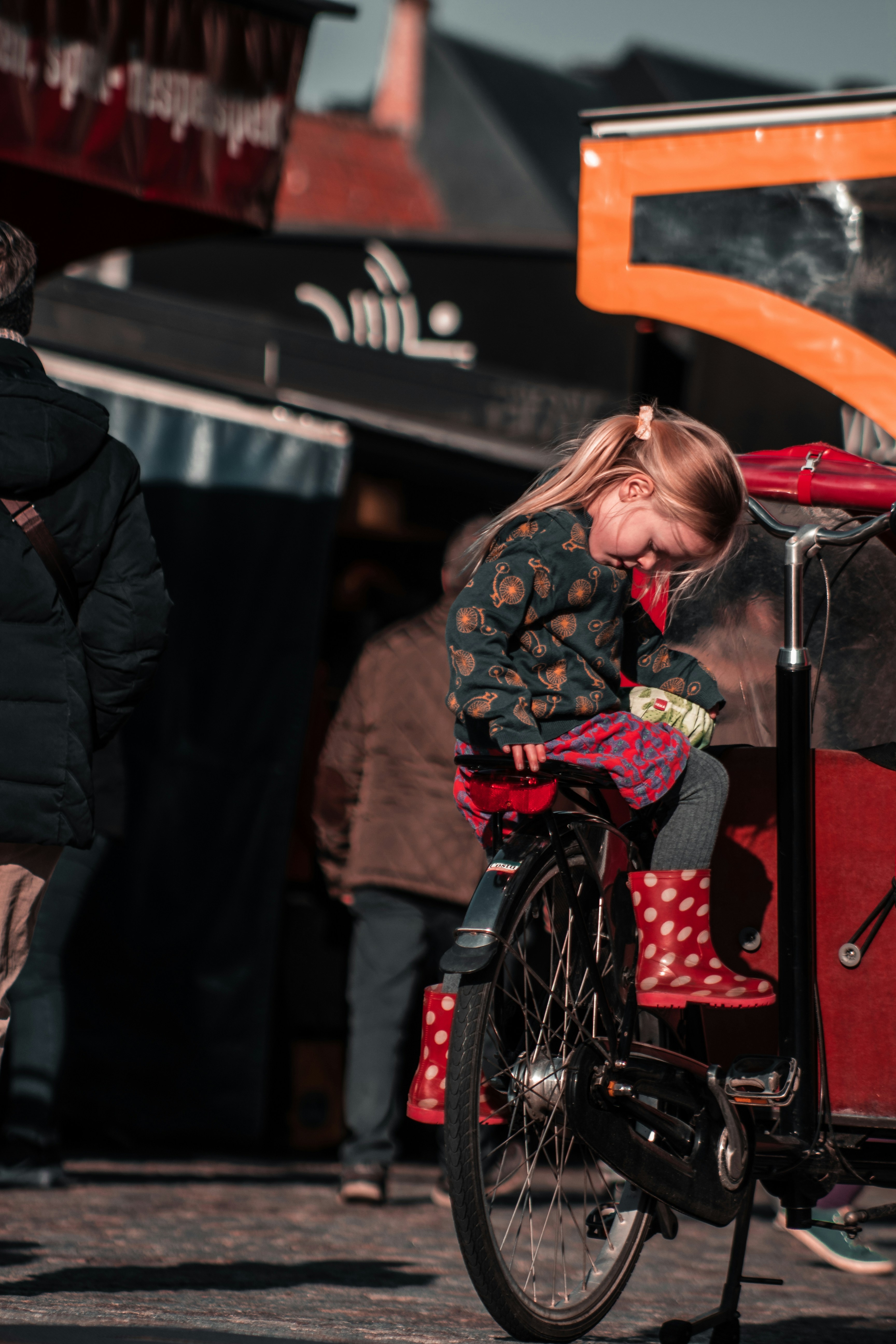 Polka-Dot Boots on a Street Bicycle: A Moment by the Market Cart