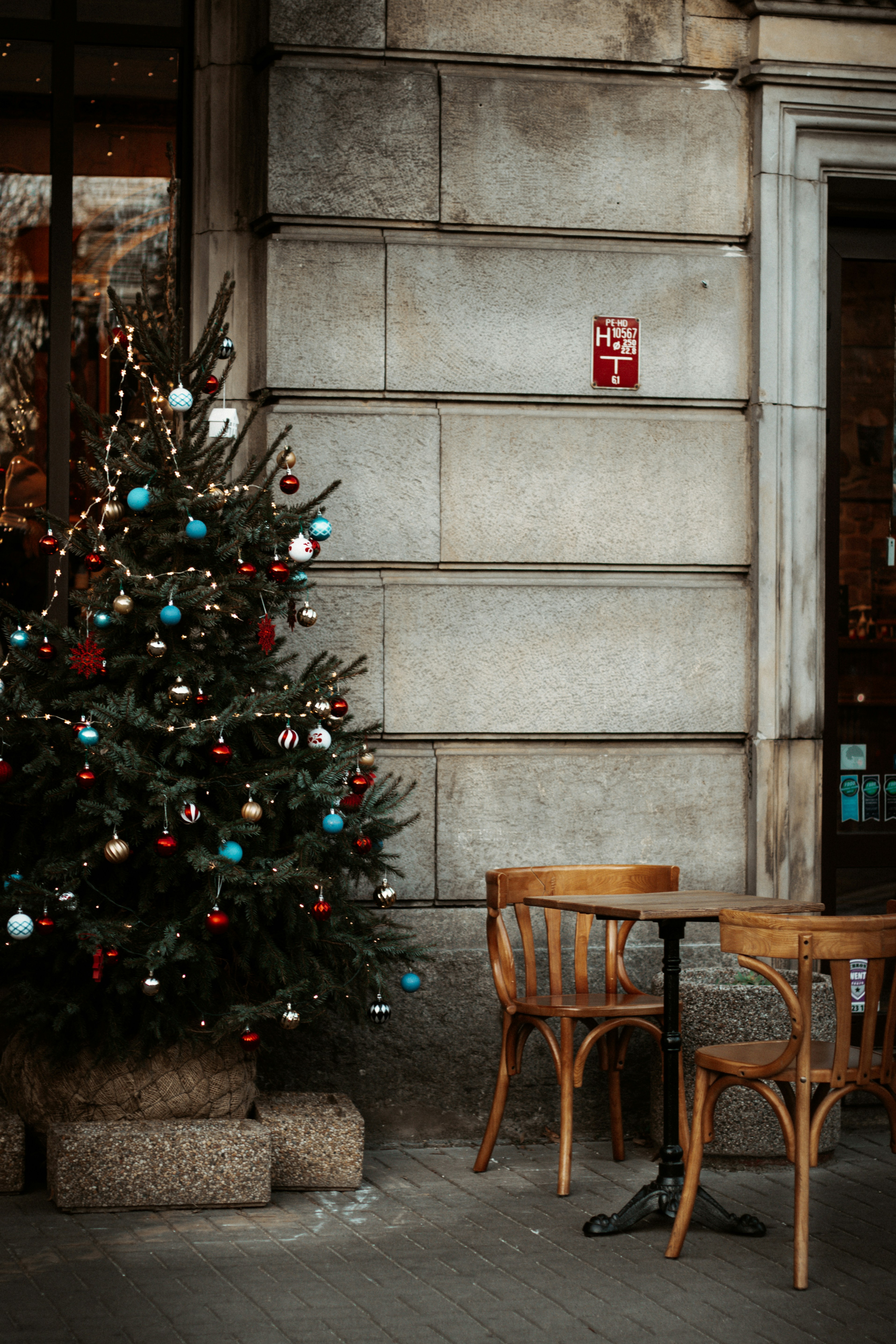 Green christmas tree with red baubles and string lights photo – Free ...