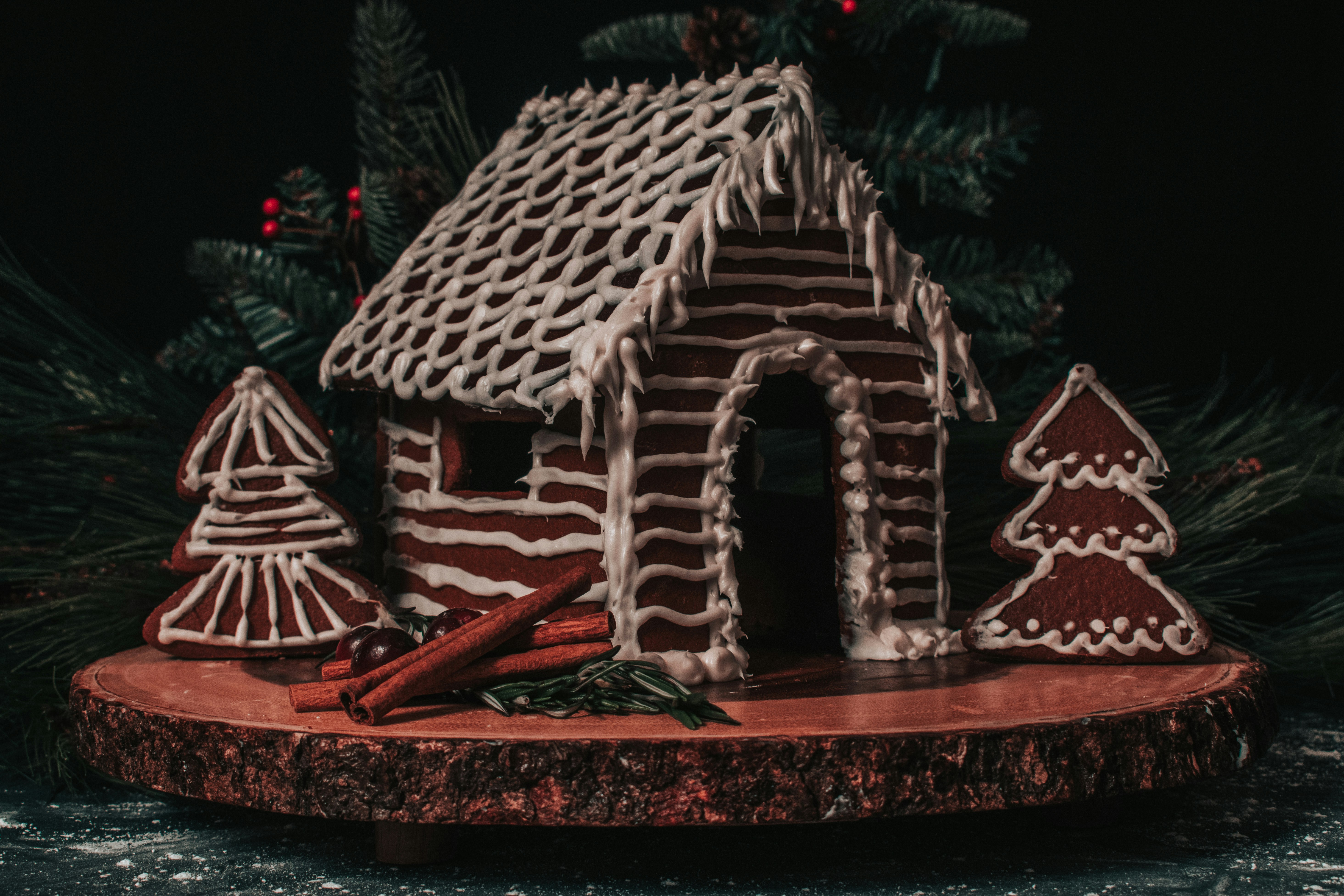 gingerbread house, trees, frosting, cinnamon sticks, cranberries, rosemary, evergreen trees, wood tray