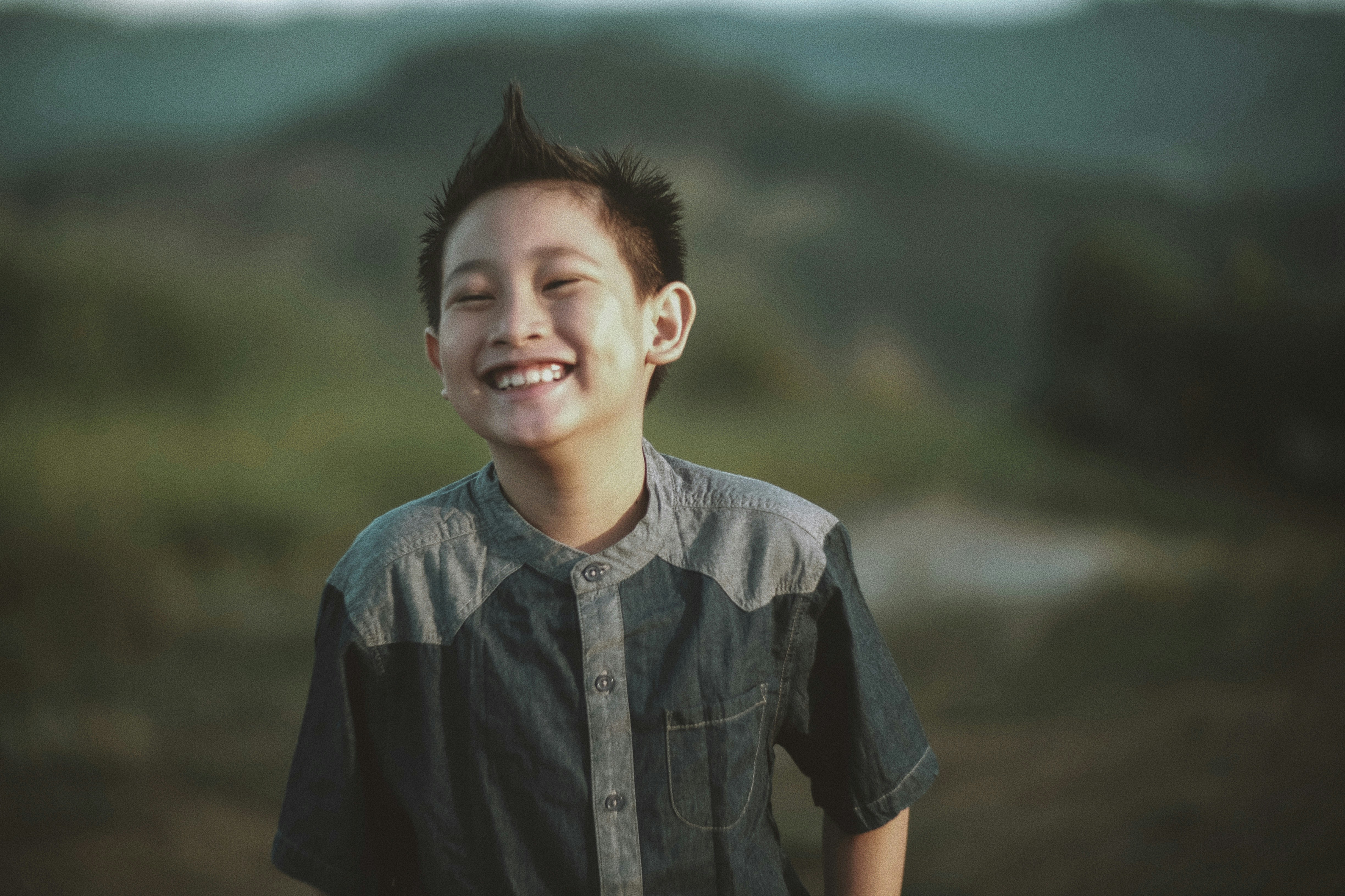 A young boy with a mohawk smiles at the camera photo – Free Funny Image ...
