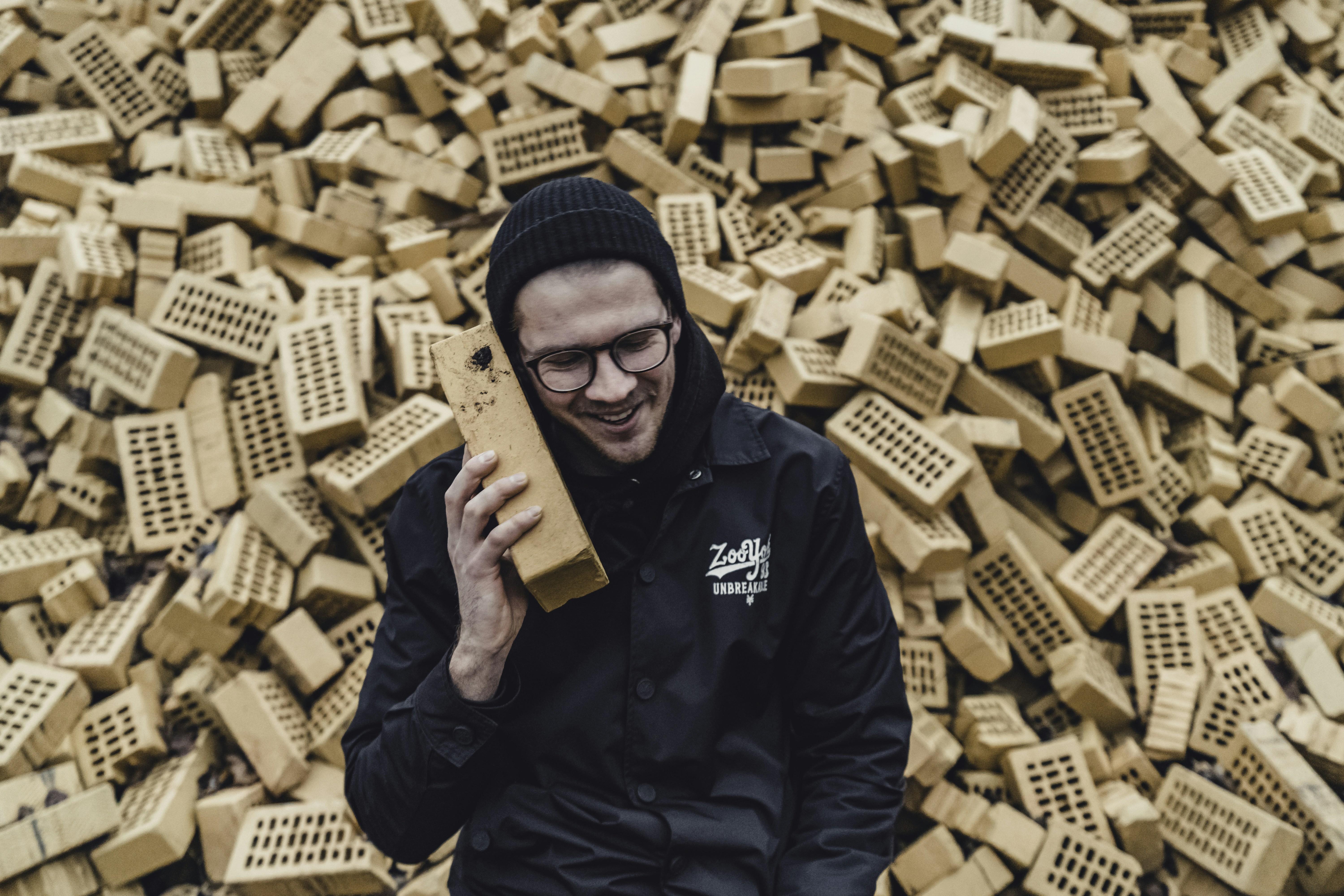 Brickphone Portrait: A Man in a Sea of Clay Blocks