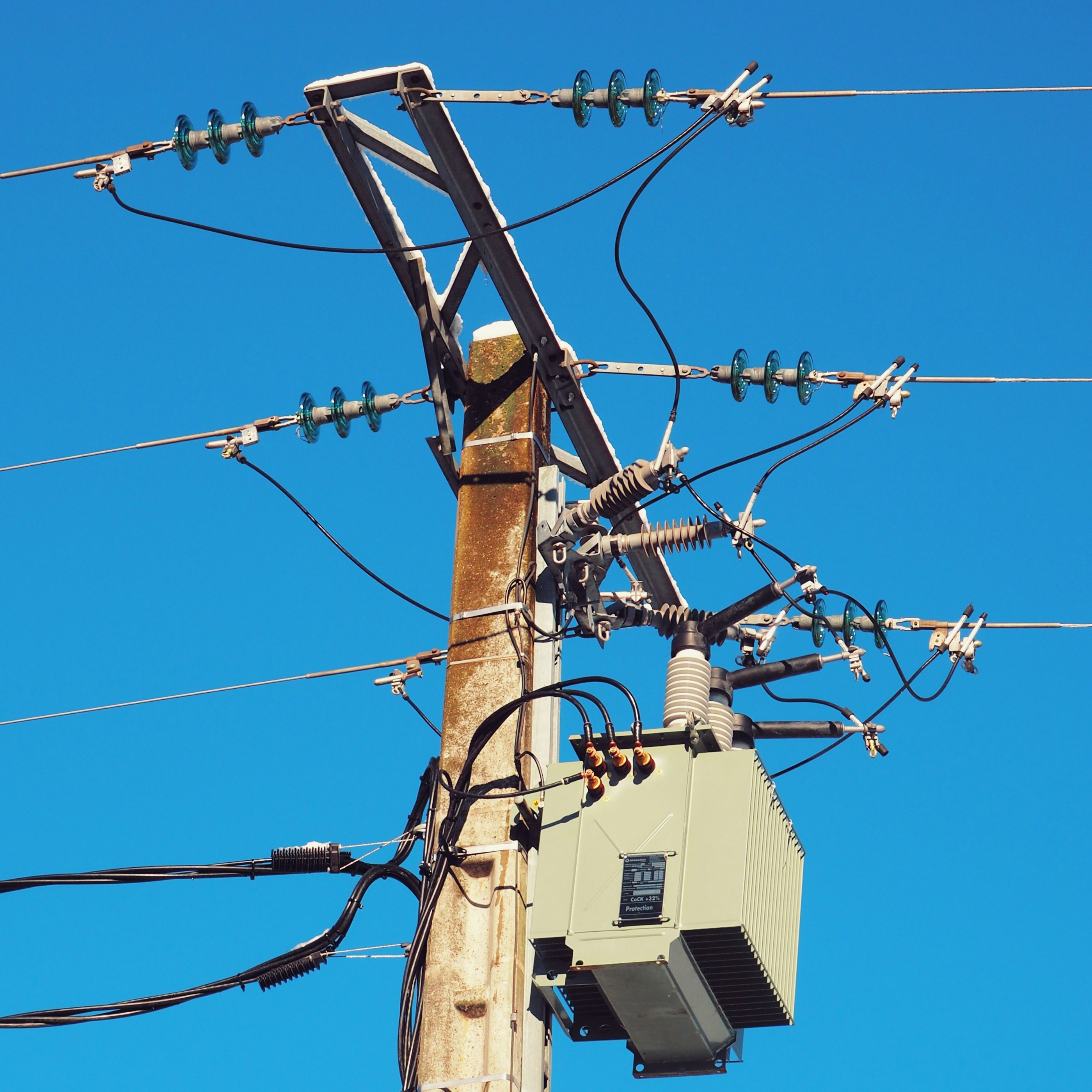 Brown wooden electric post under blue sky during daytime photo – Free ...