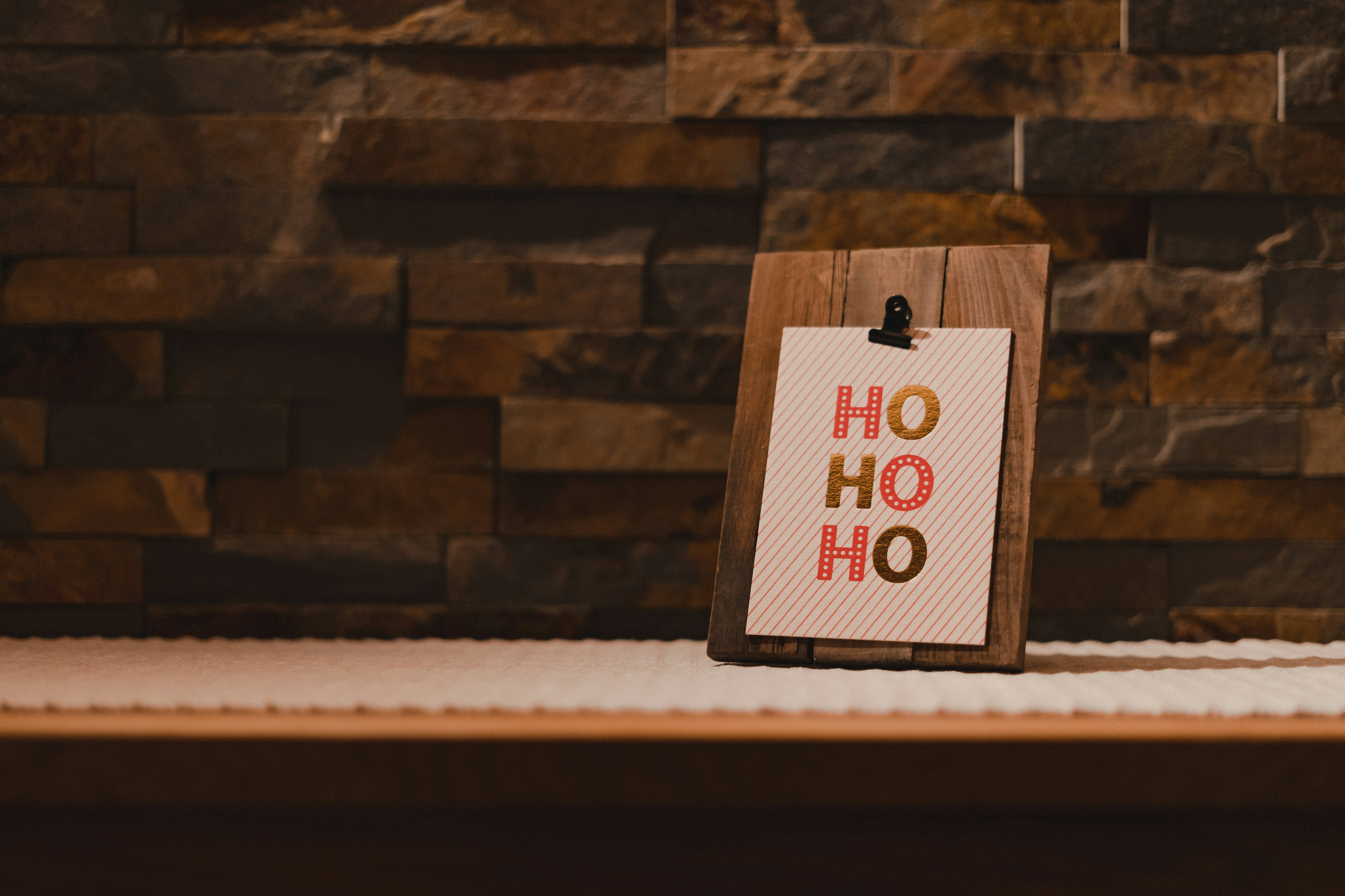 Tiny Christmas Card on a Rustic Brick Shelf
