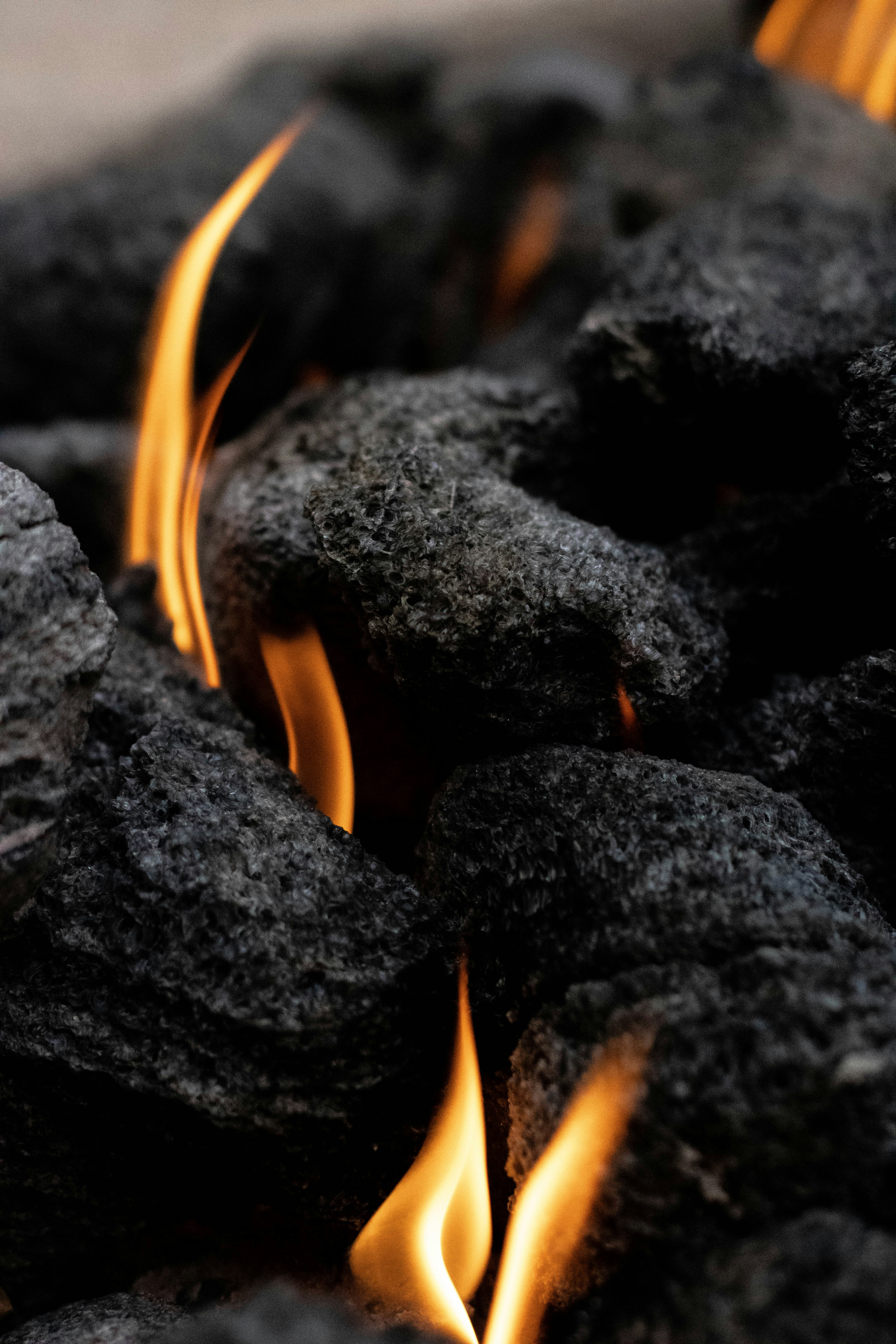Luminous Ember Between Charcoal Peaks