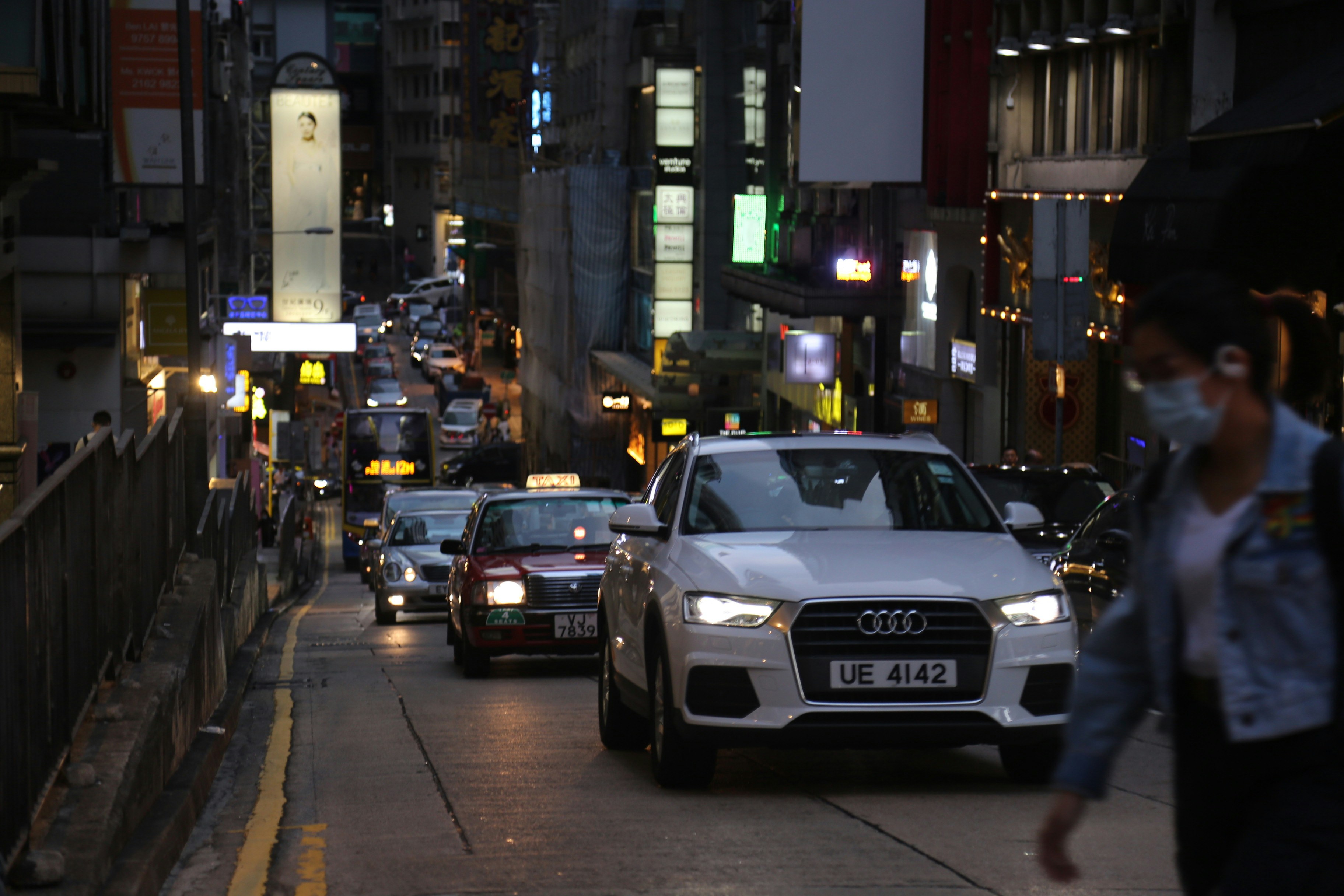 Downtown Hong Kong the concrete jungle | white audi car on road during daytime