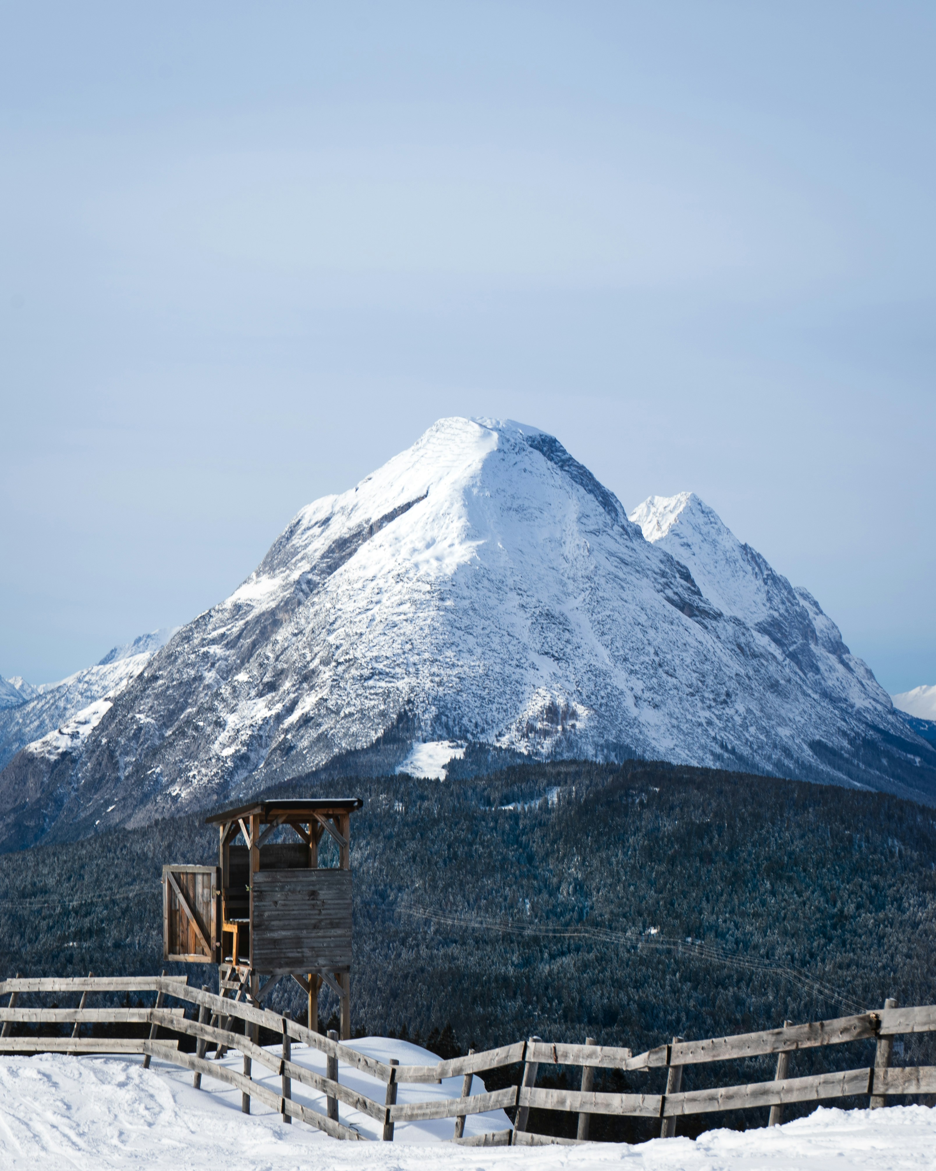 Snow Peak Overlook: A Wooden Camouflaged Lifeboat Against Alpine Silence
