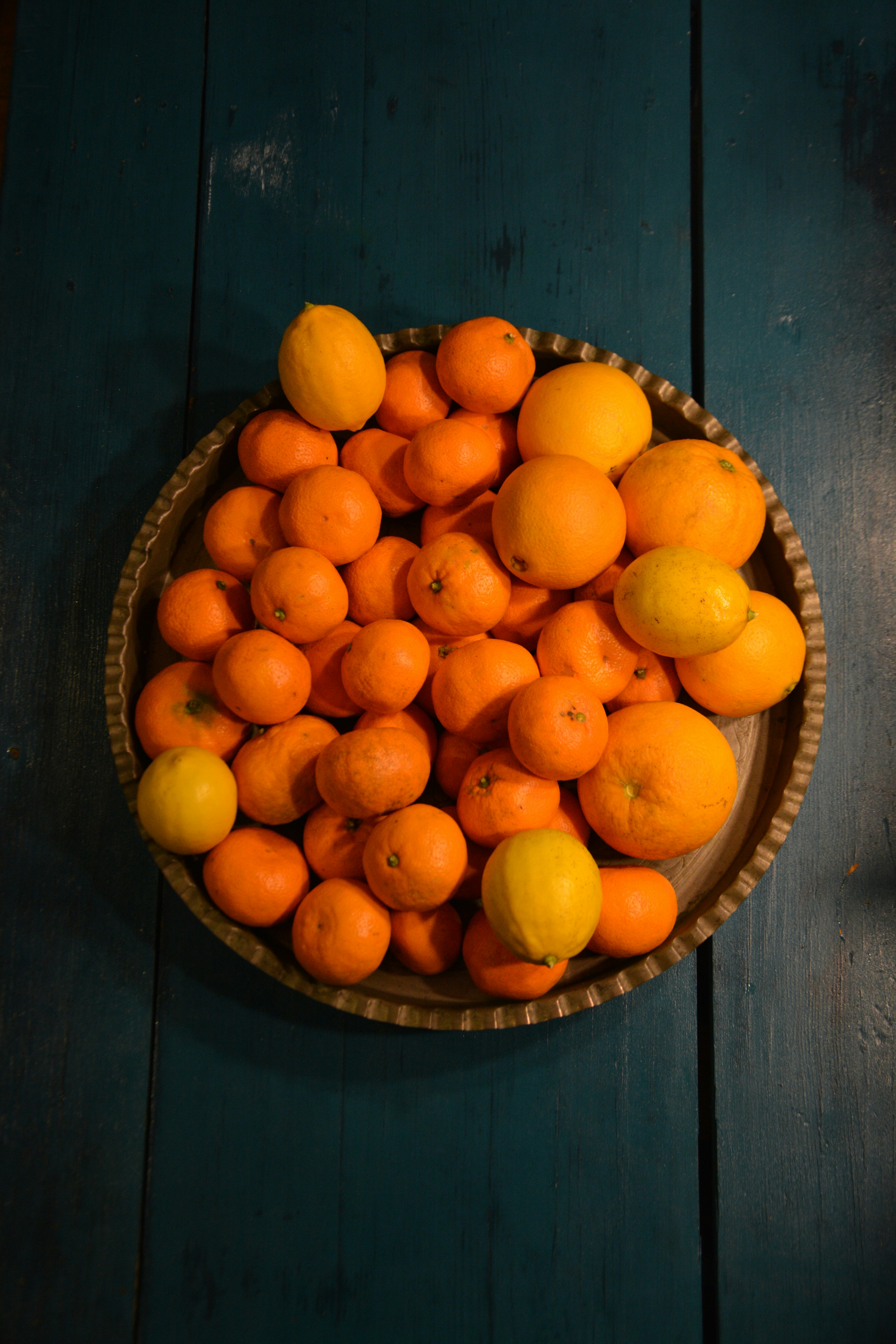 orange fruits on brown woven basket