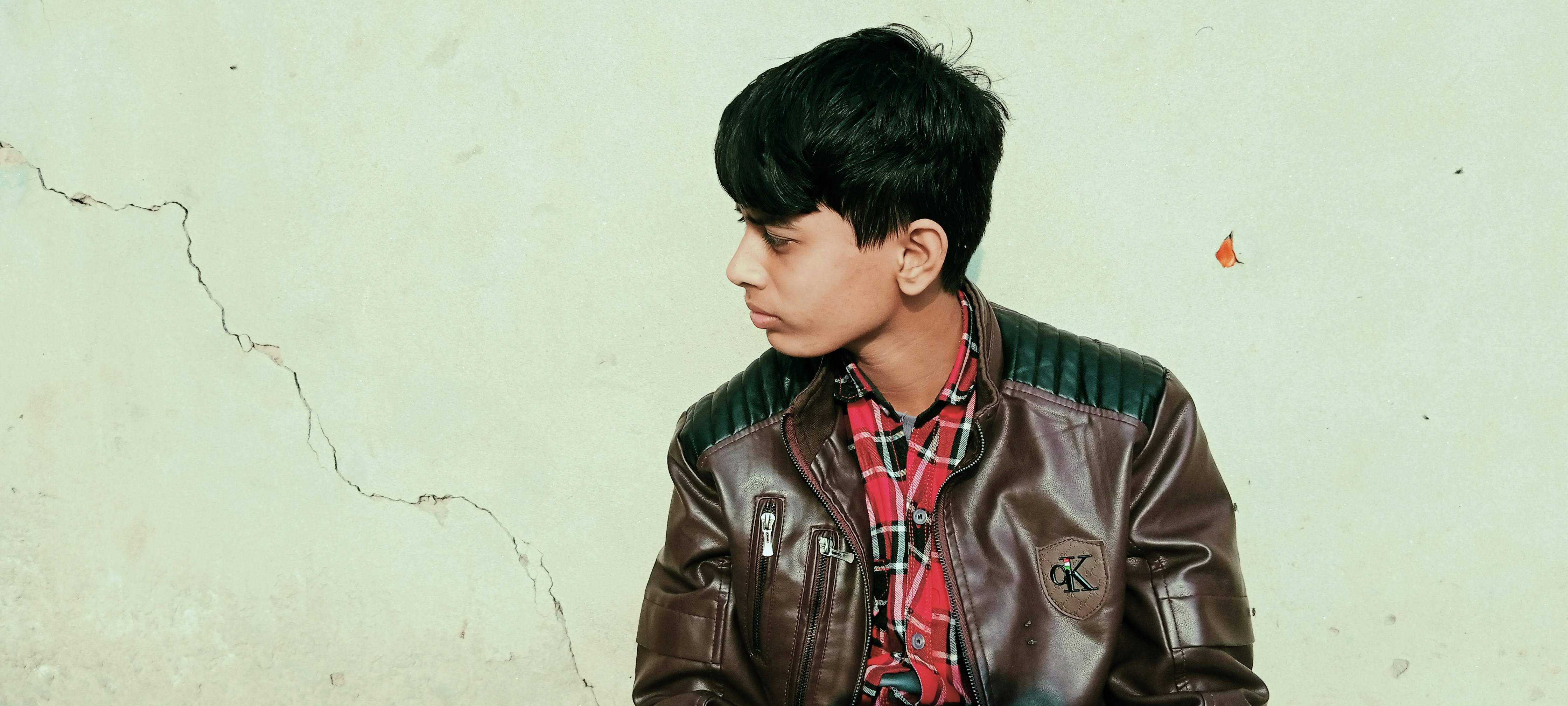 man in brown leather jacket