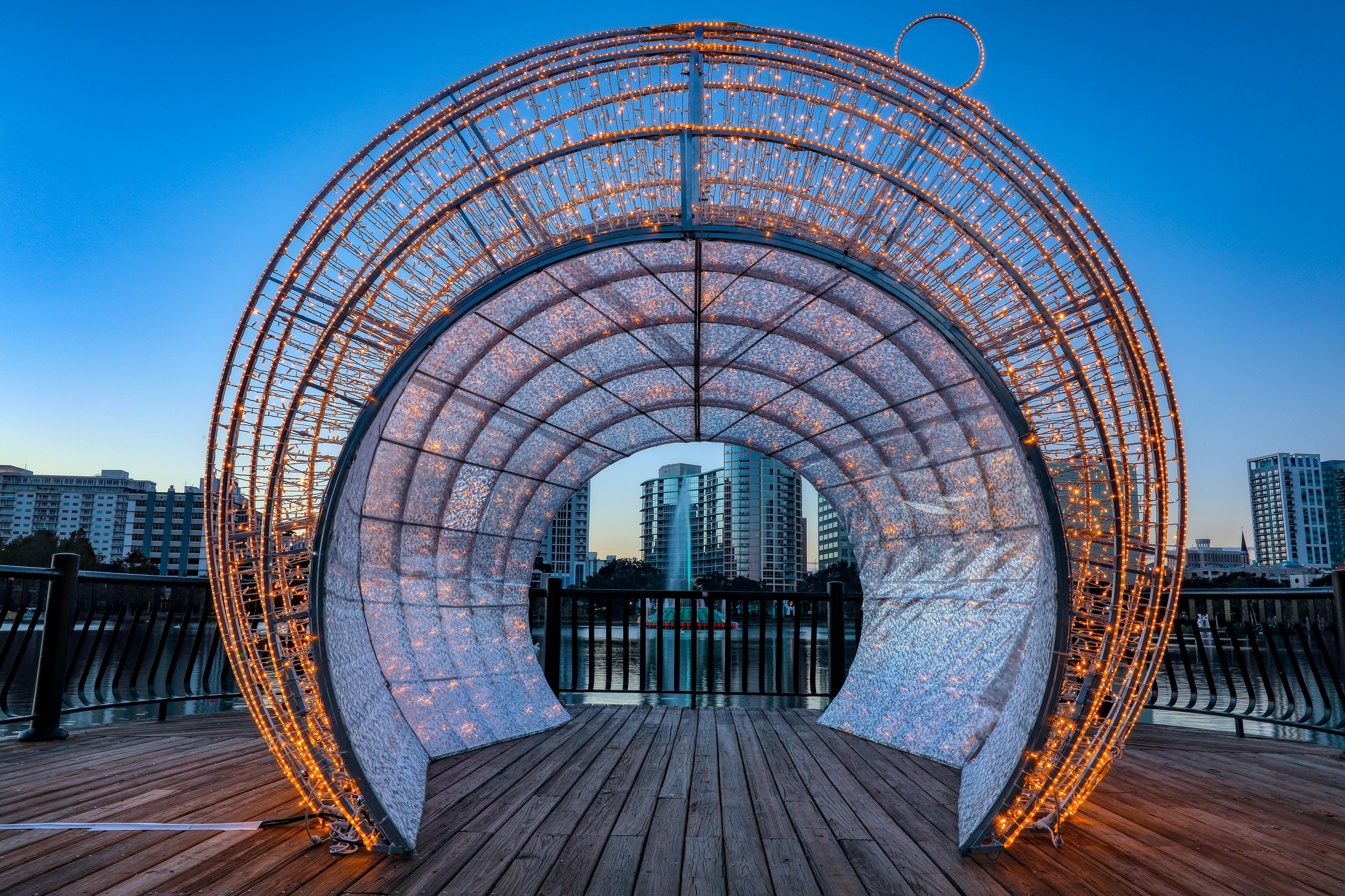 Illuminated Ring Tunnel Framing the City at Dusk