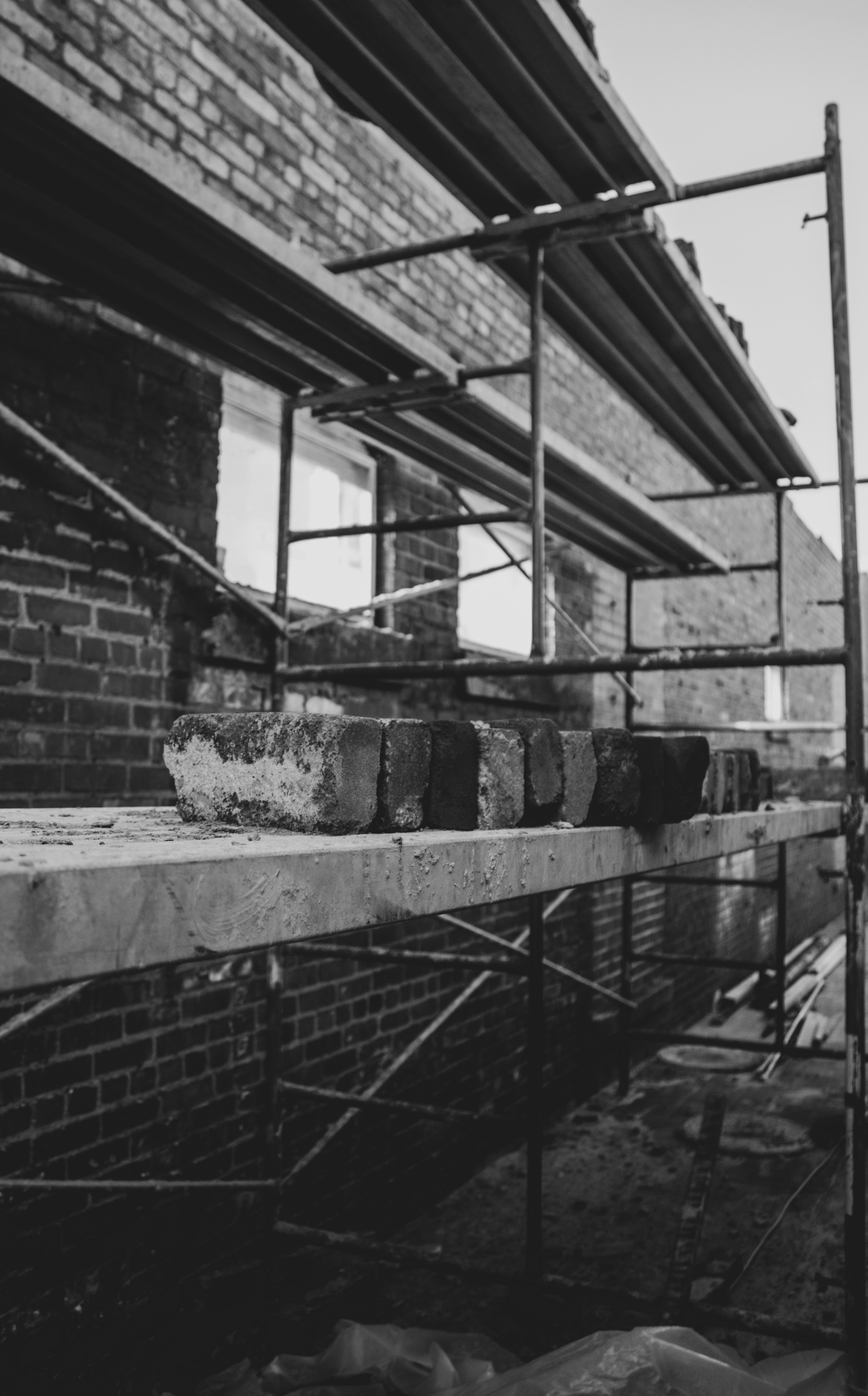 Bricks and Scaffolding: A Quiet Moment on a Feigned Construction