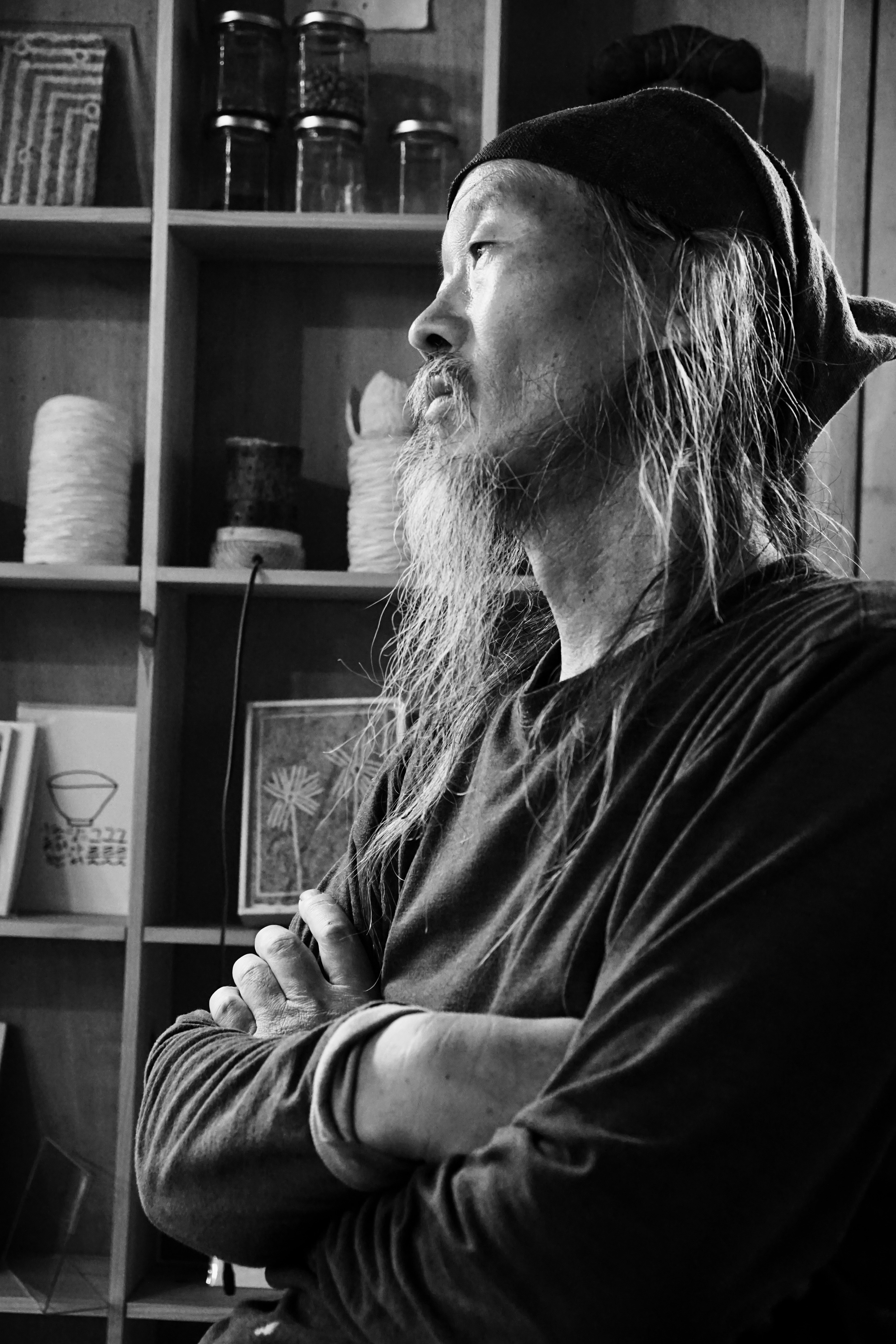 Sleeved in Quiet Resolve: A Portrait in Contemplation