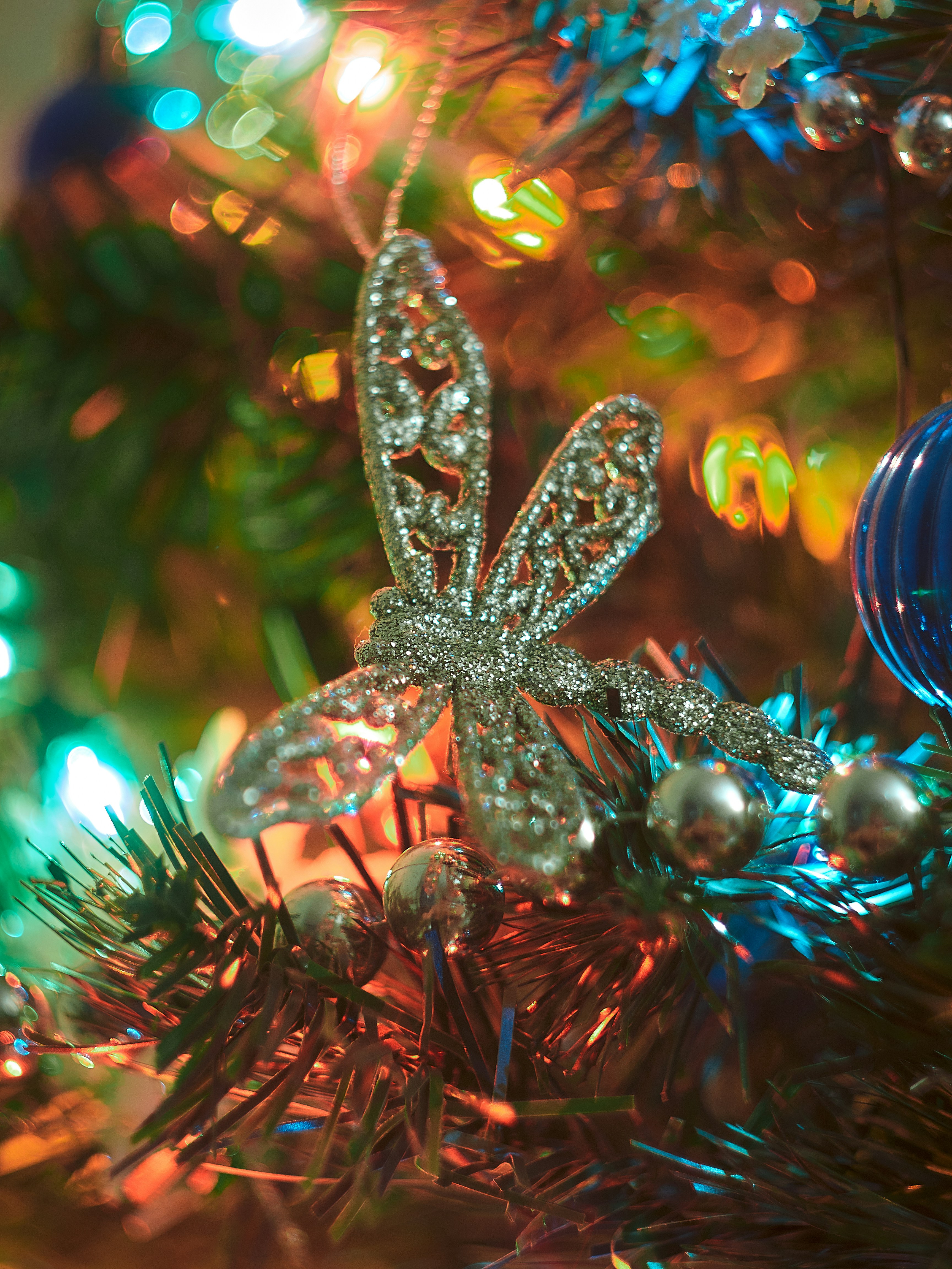 Glitterwing Dragonfly Amid Neon Christmas Glow