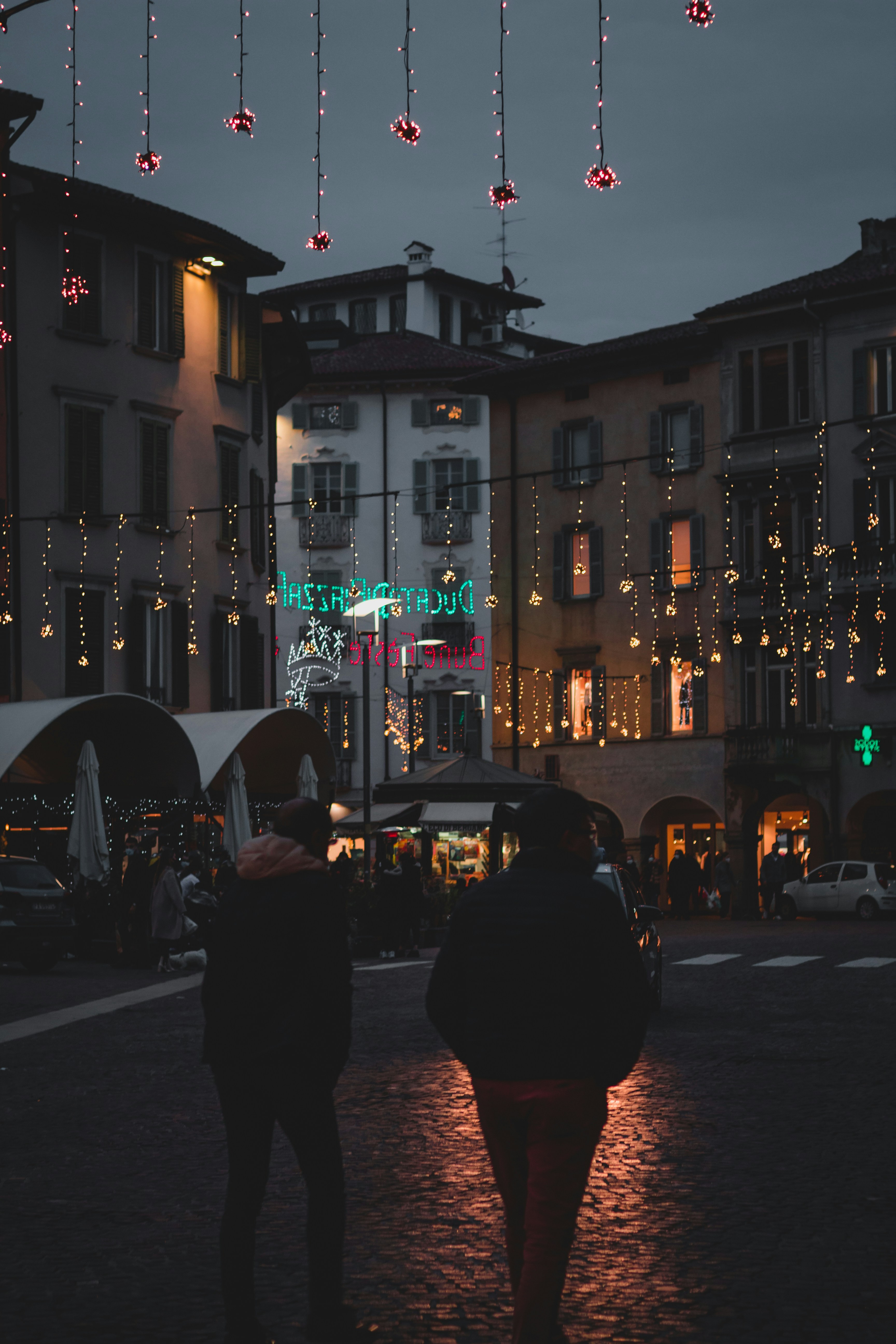 people walking on street during night time
